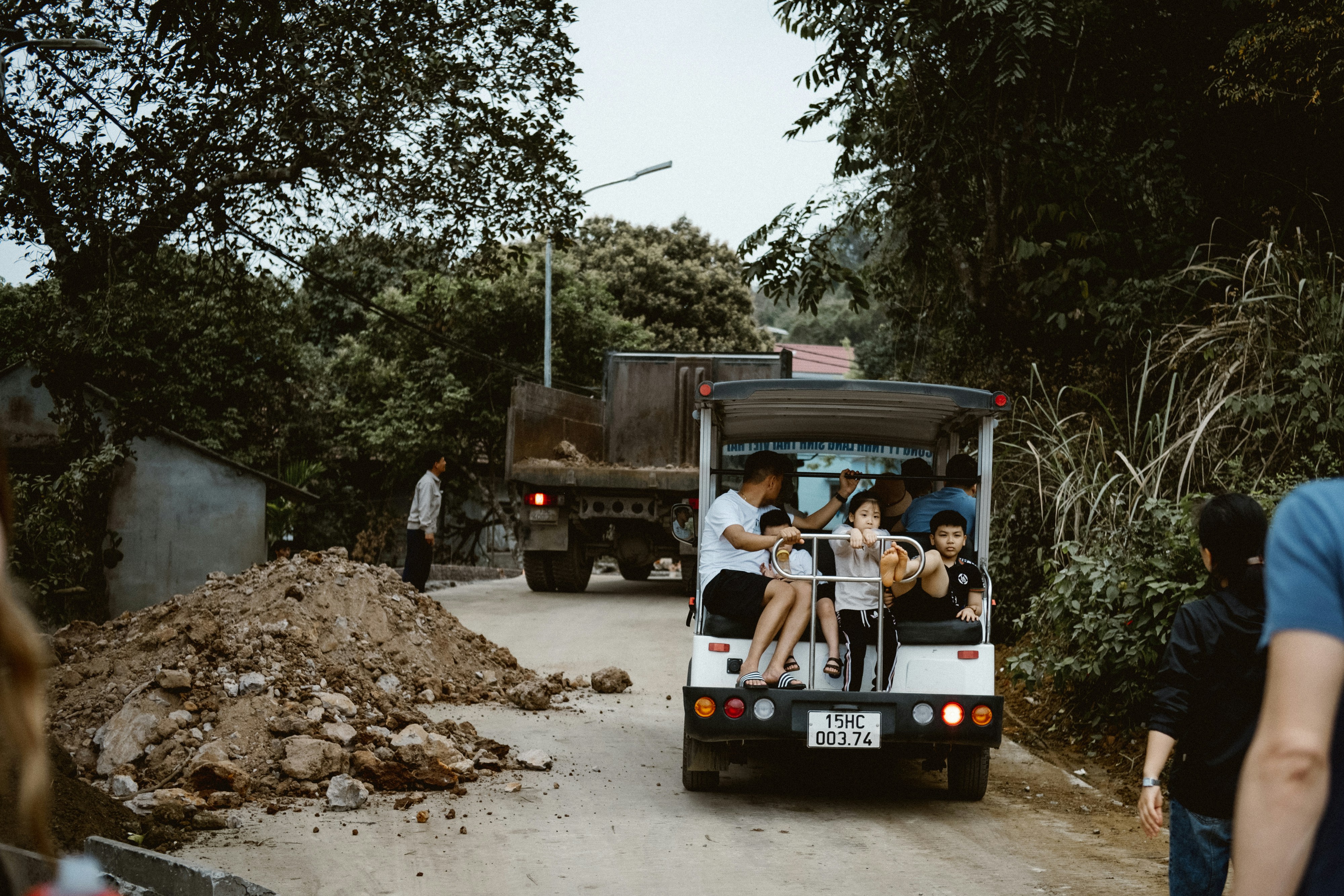 A group of people riding on the back of a truck photo – Free Woman ...