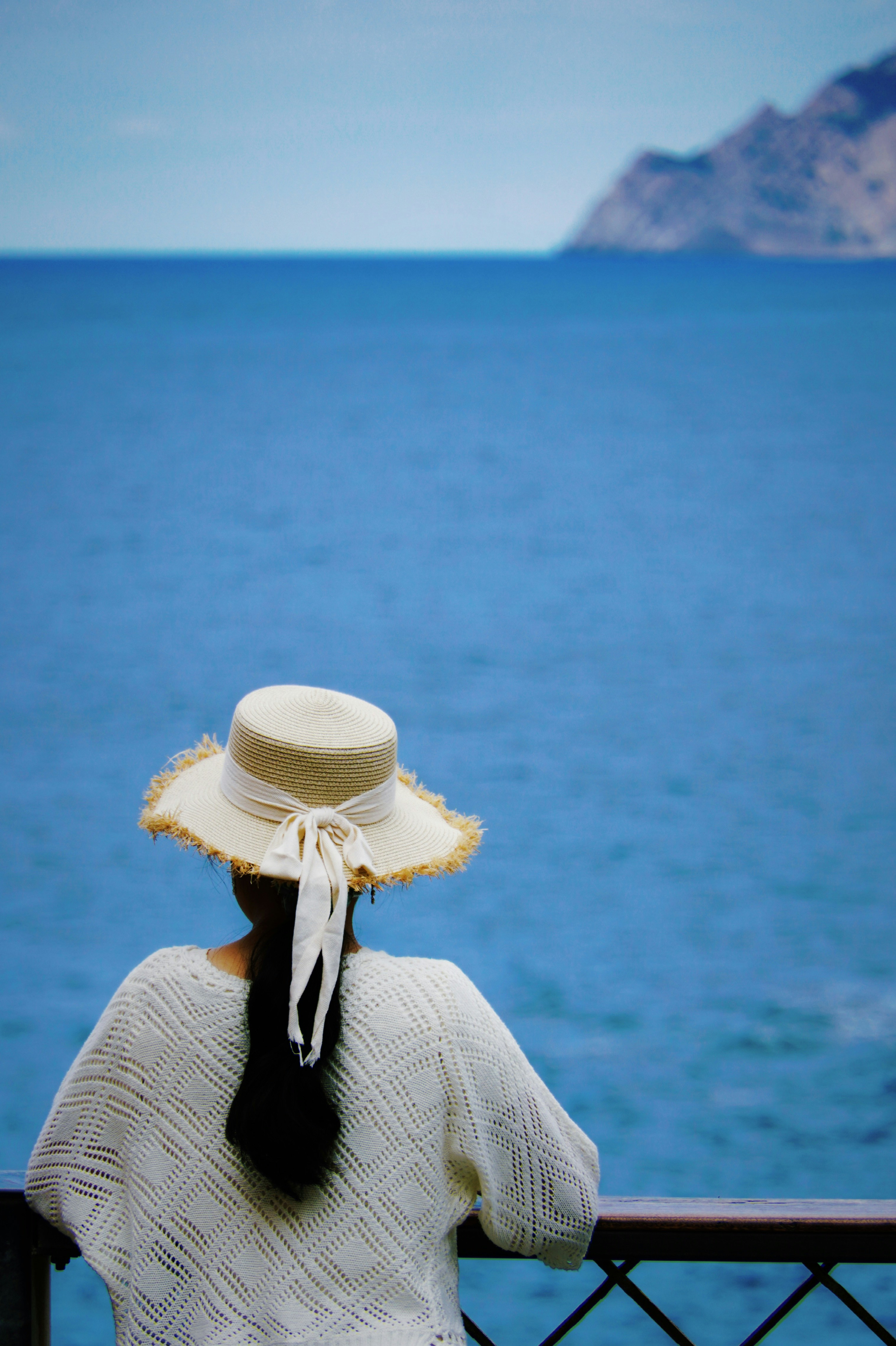 Horizon Gaze: Seaside Portrait in Straw and Knit