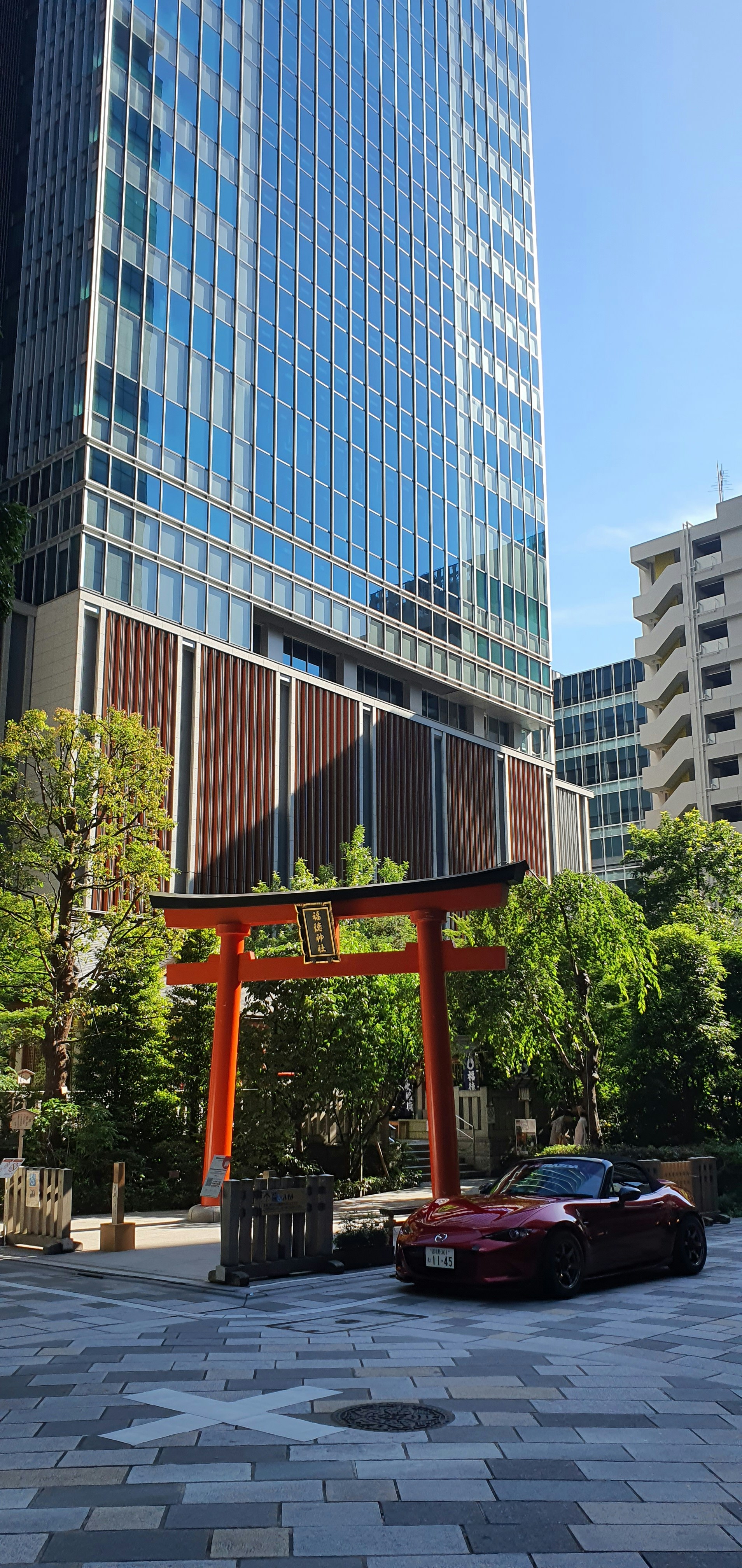 Tokyo Torii Under Skyscraper Shade