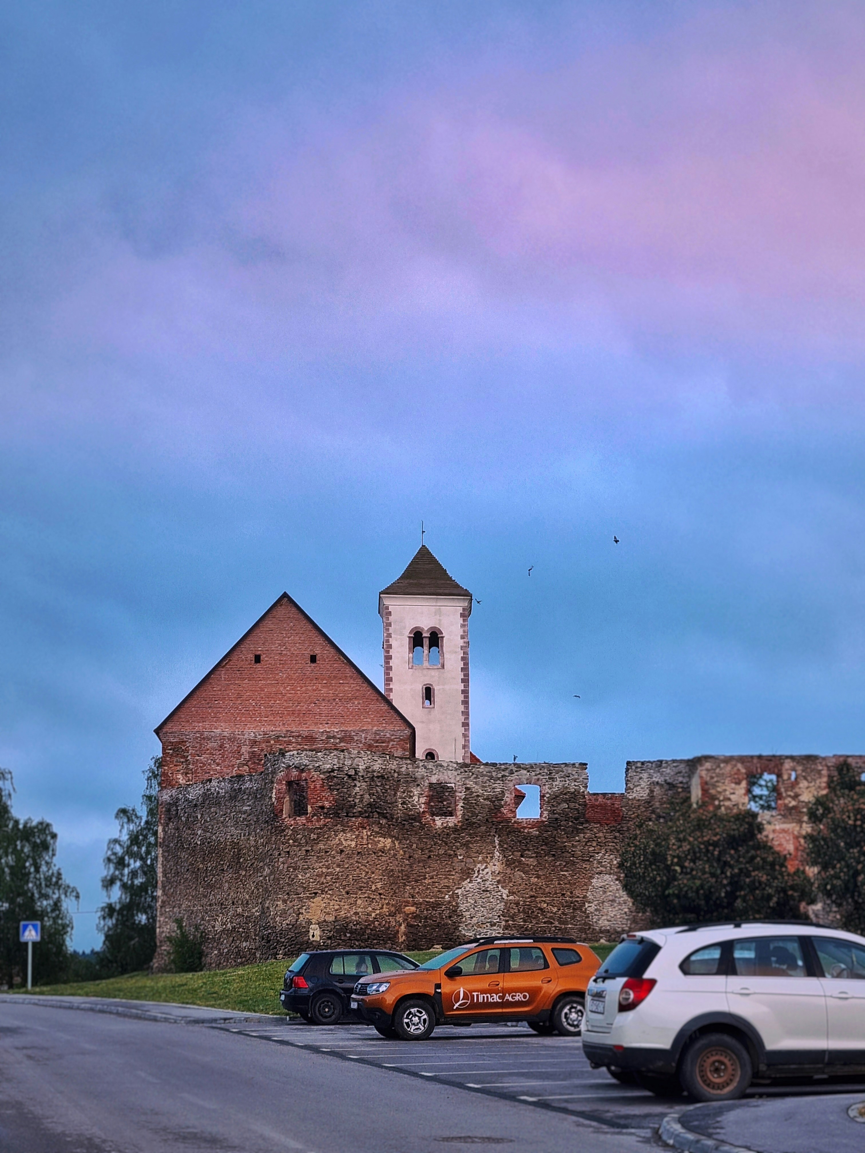 Twilight Sentinel: A Tower Over a Quiet Parking Lot