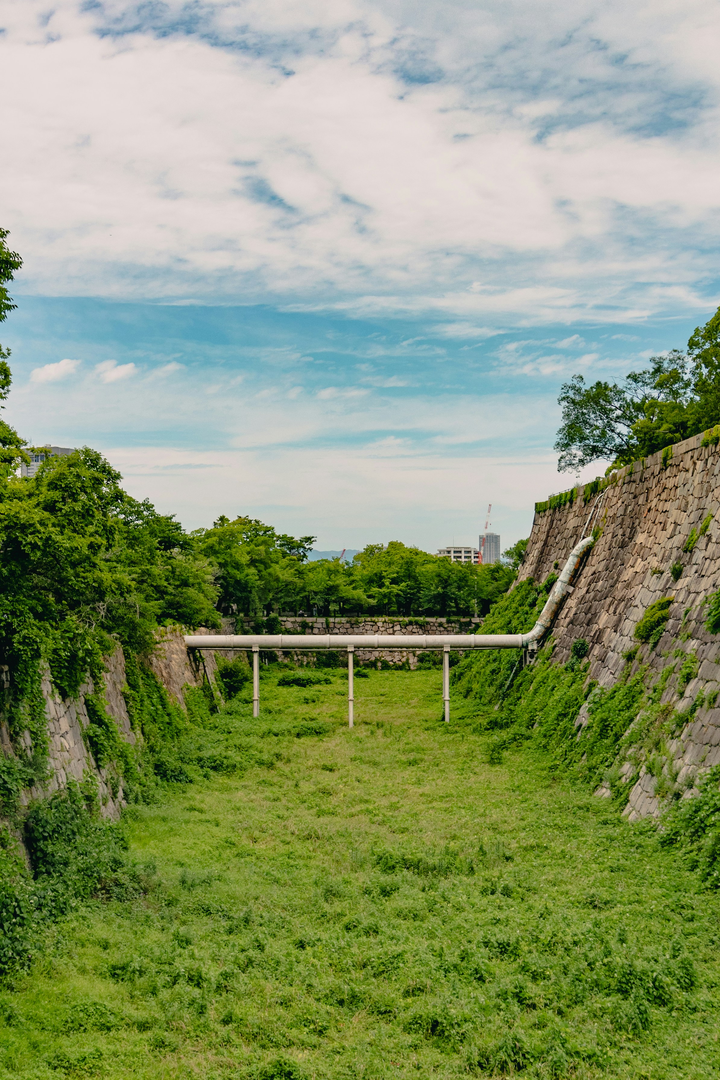 Span Across the Green Moat: A Pipeline Crossing Between Stone Walls