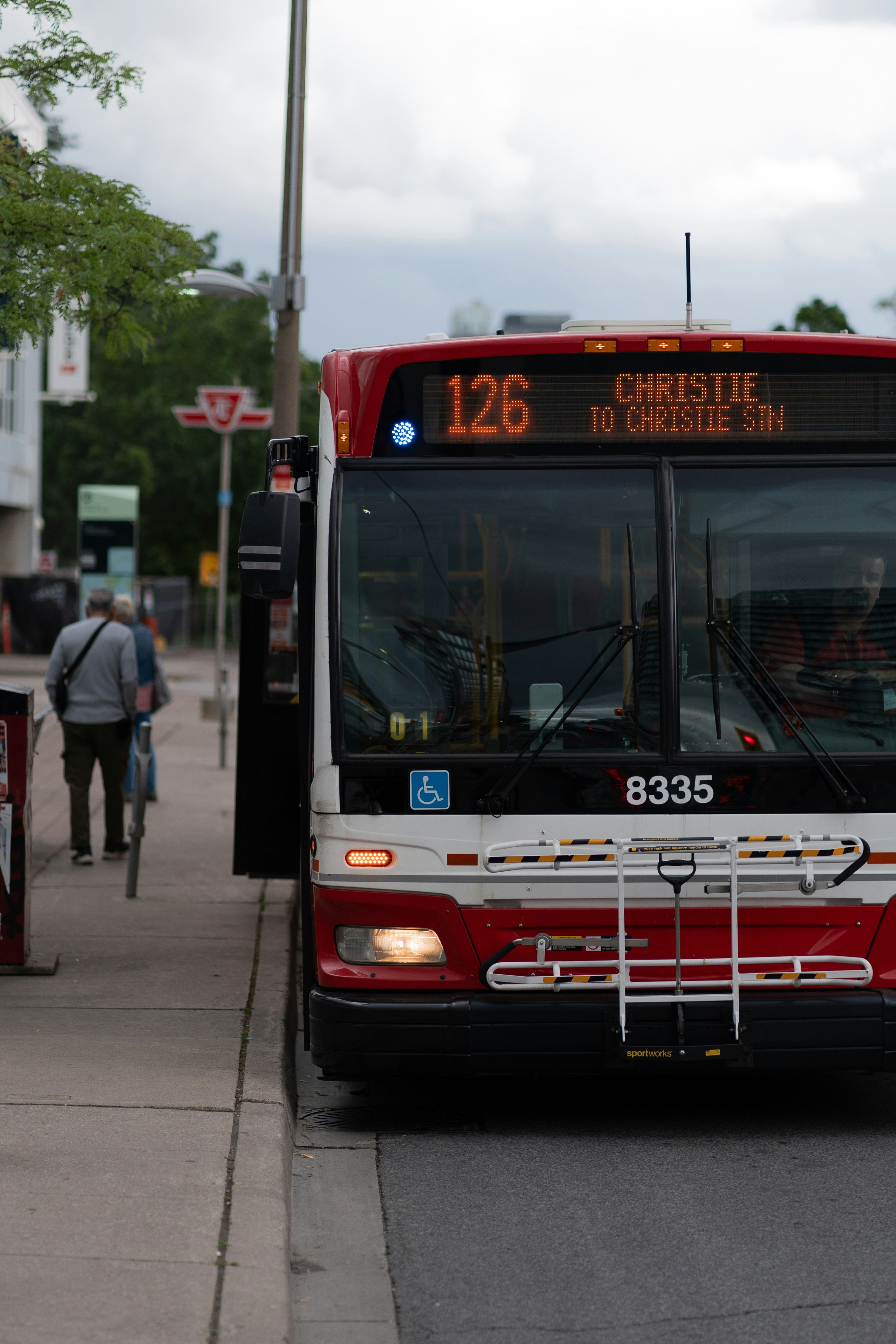 Close-Cropped Red City Bus: Route 126 at the Stop