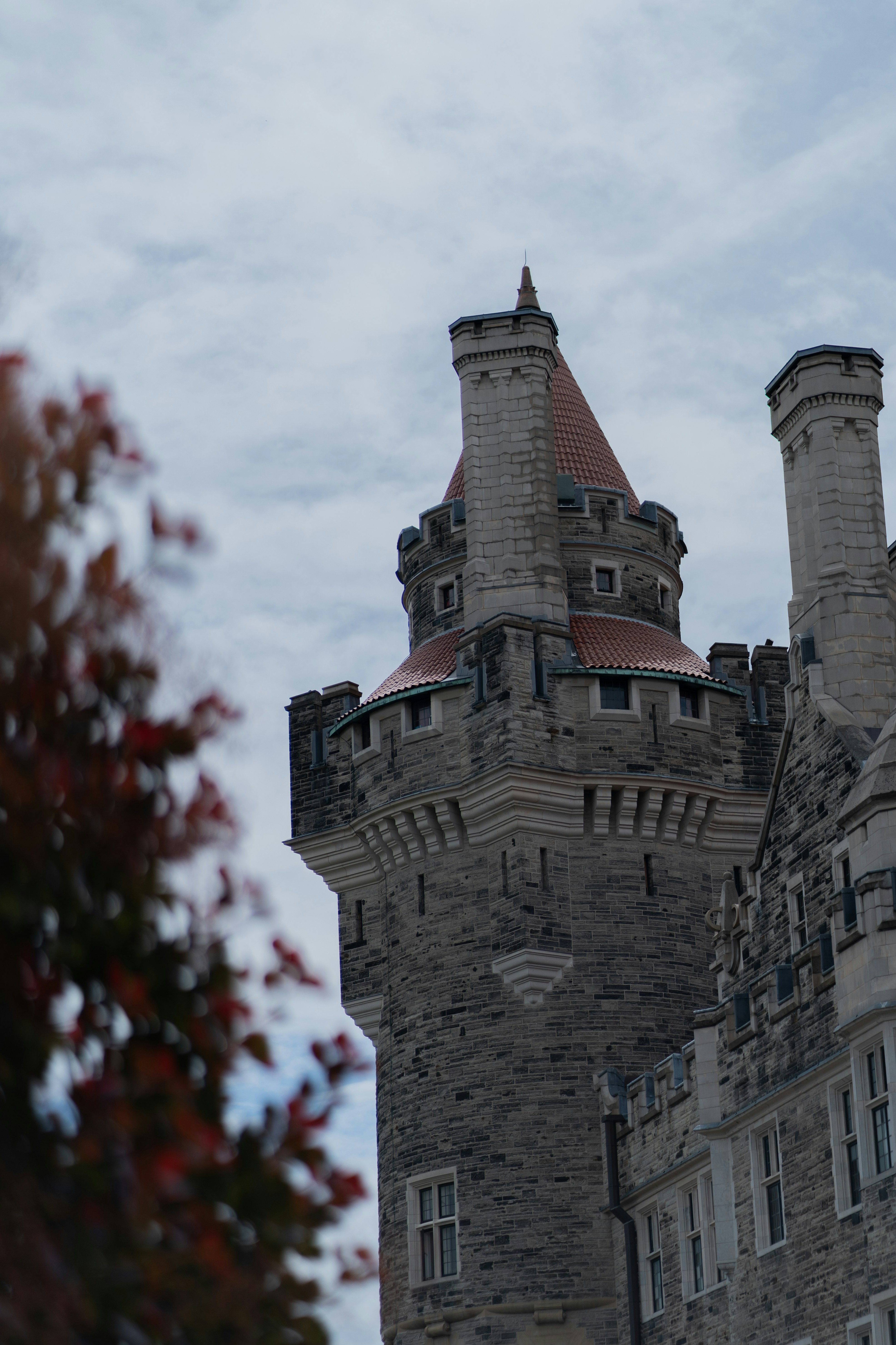 A large castle like building with a clock on it's side photo – Free ...