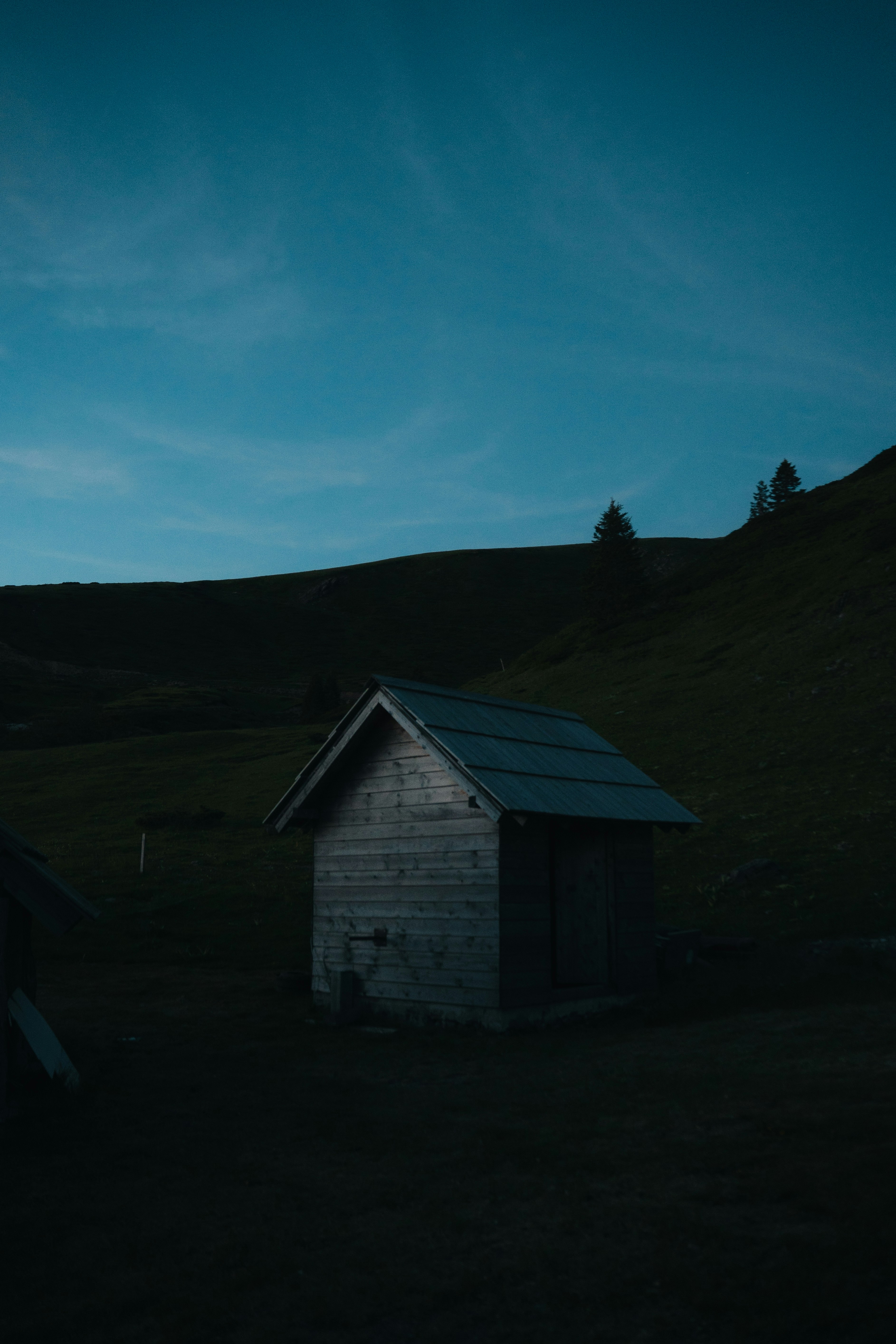 A small shack sitting in a field at night photo – Free Montenegro Image ...