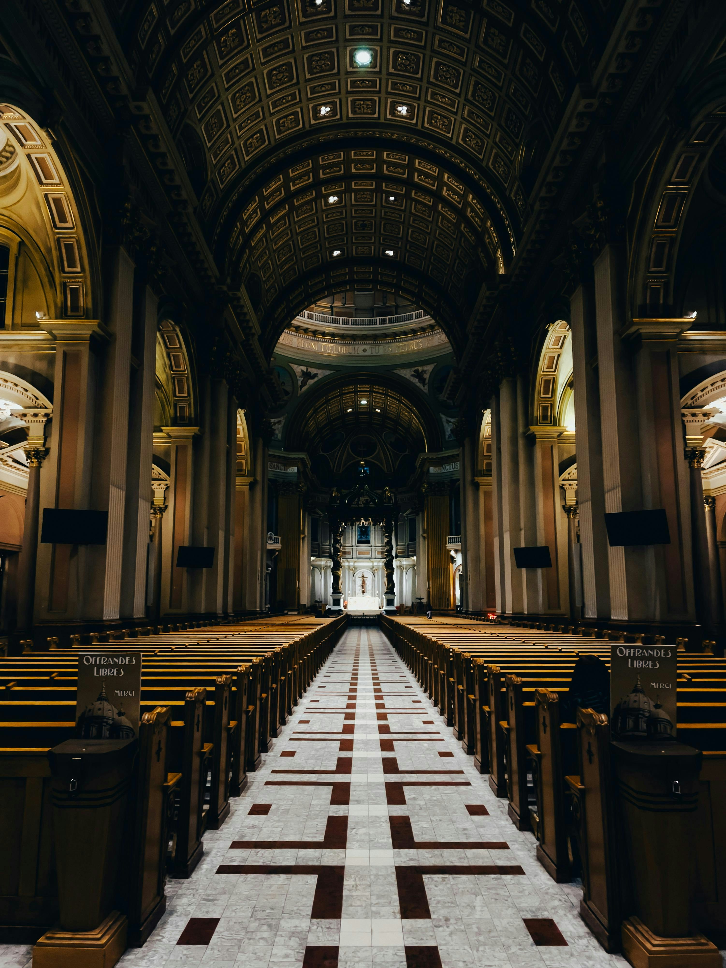 An empty church with pews and a checkered floor photo – Free Building ...