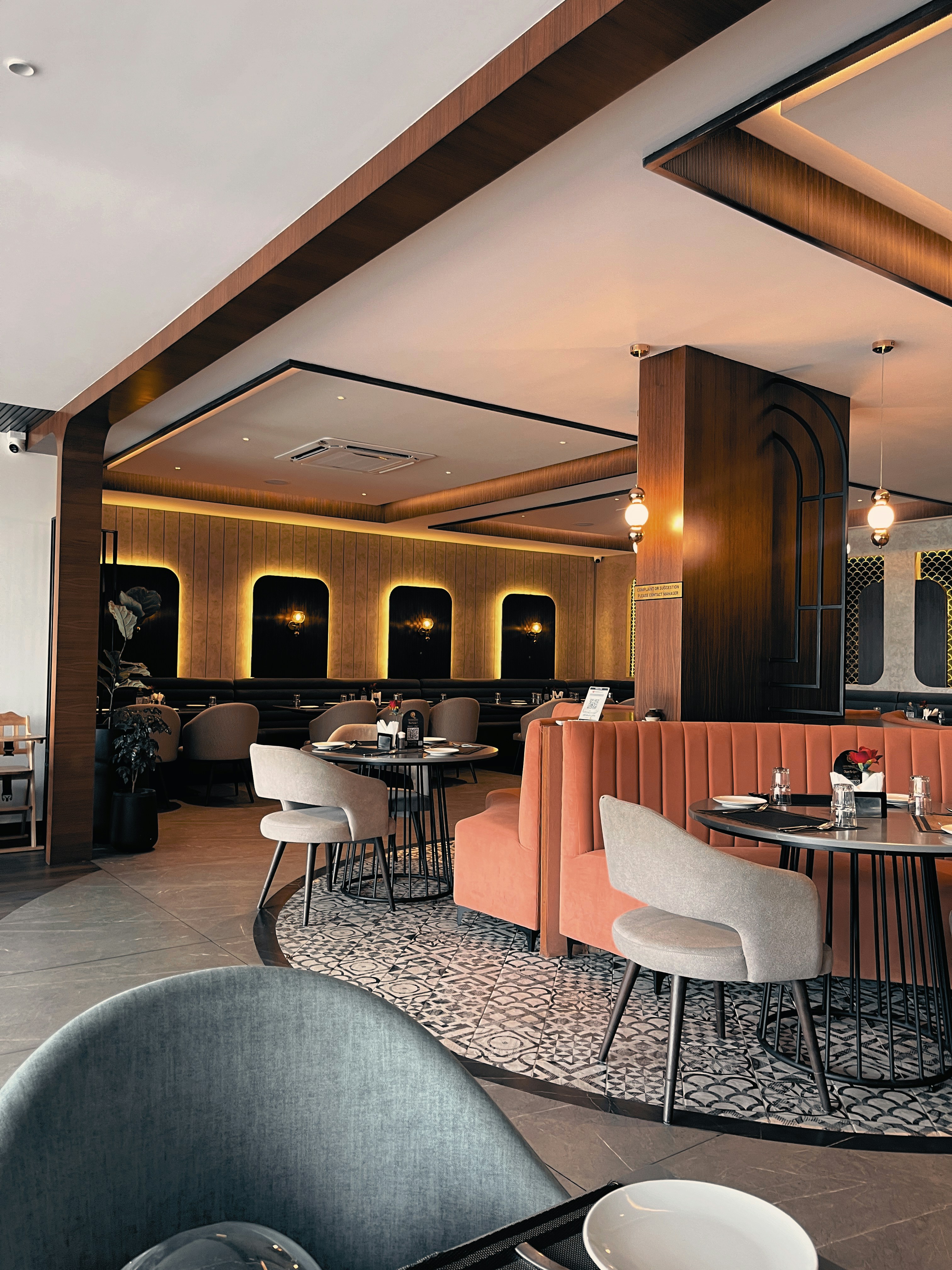 A restaurant with a large dining area with tables and chairs photo ...