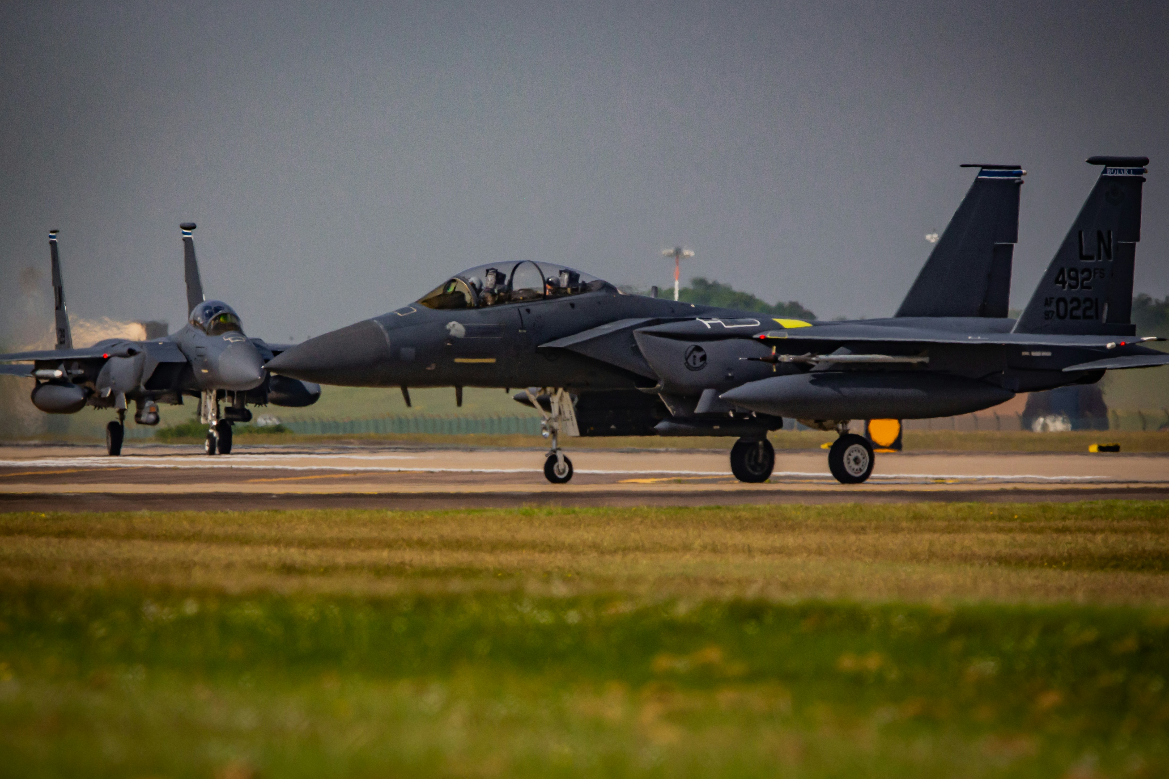 A fighter jet sitting on top of an airport runway photo – Free Aircraft ...