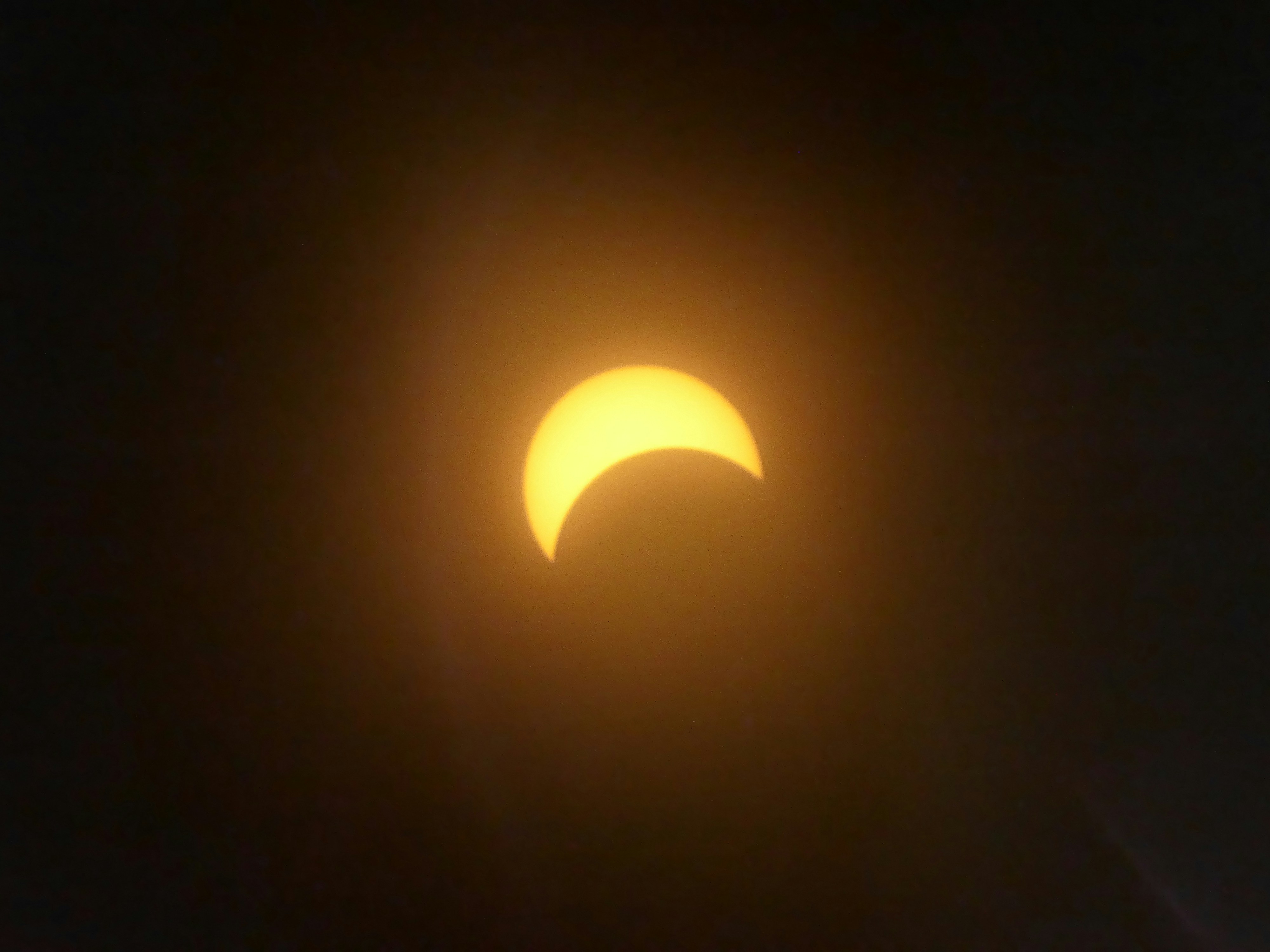 Crescent Sun: A Quiet Partial Eclipse Painted in Night