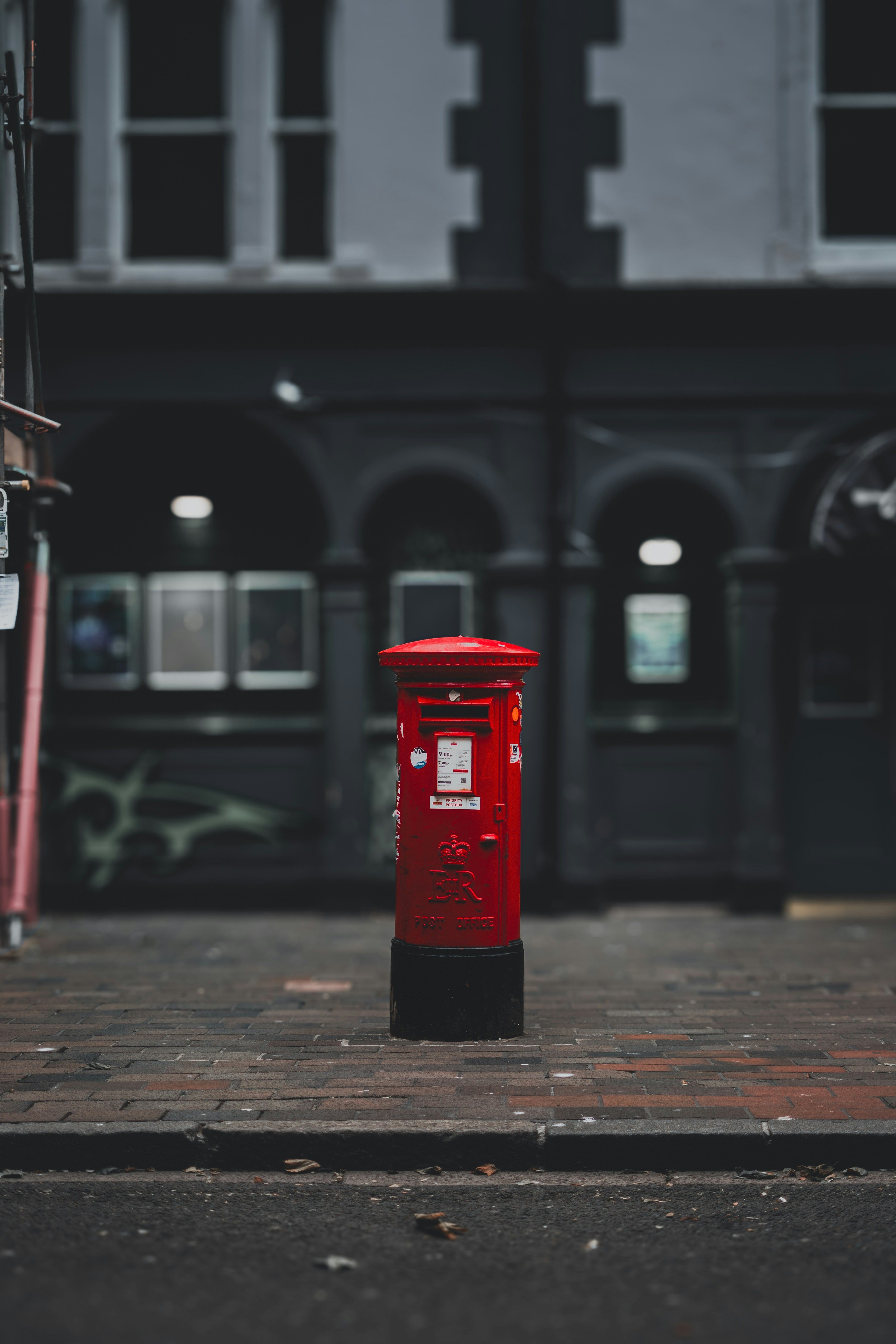 A red post box sitting on the side of a road photo – Free Uk Image on ...