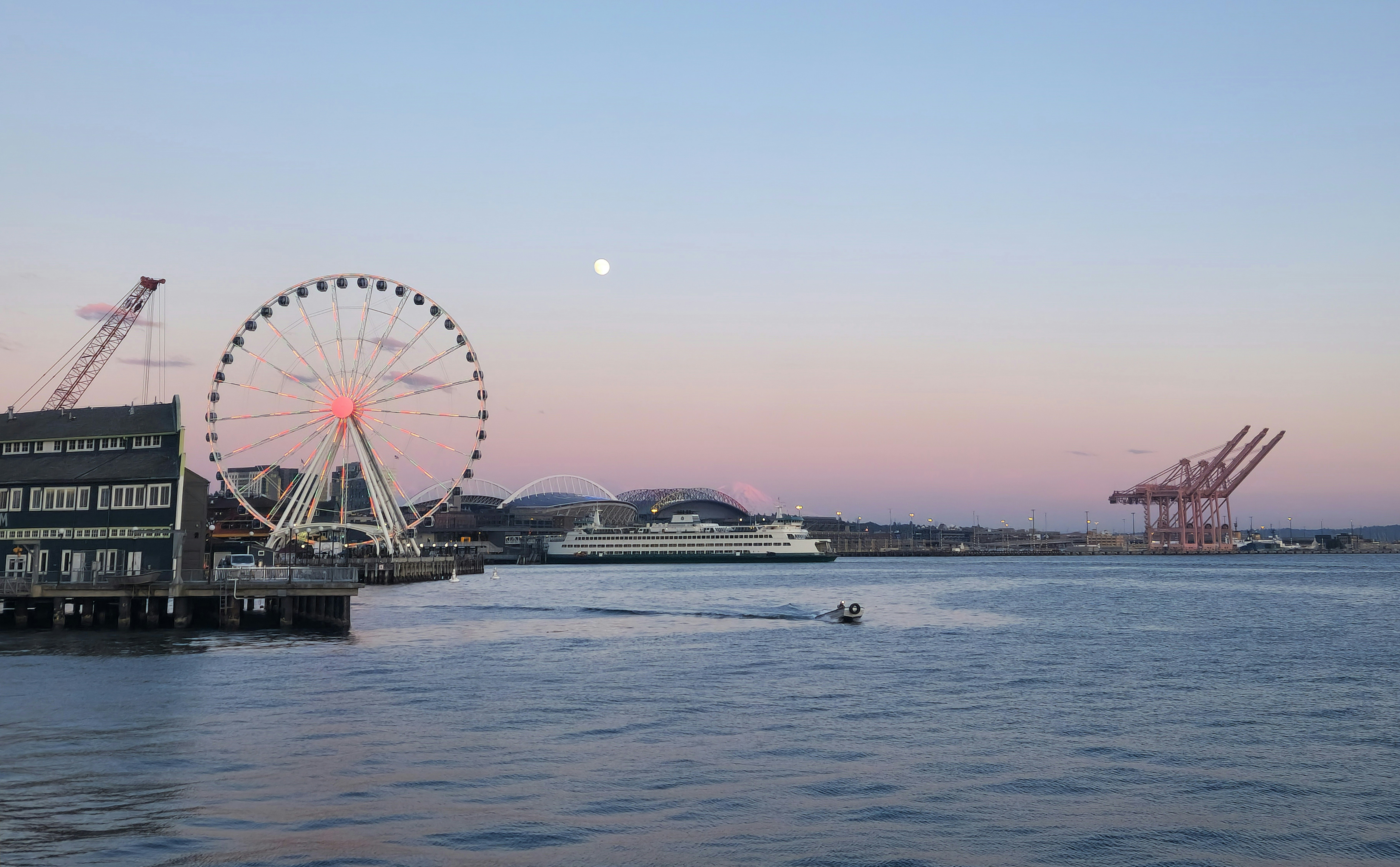 Dusk by the Docks: The Ferris Wheel Illuminates a Quiet Harbor