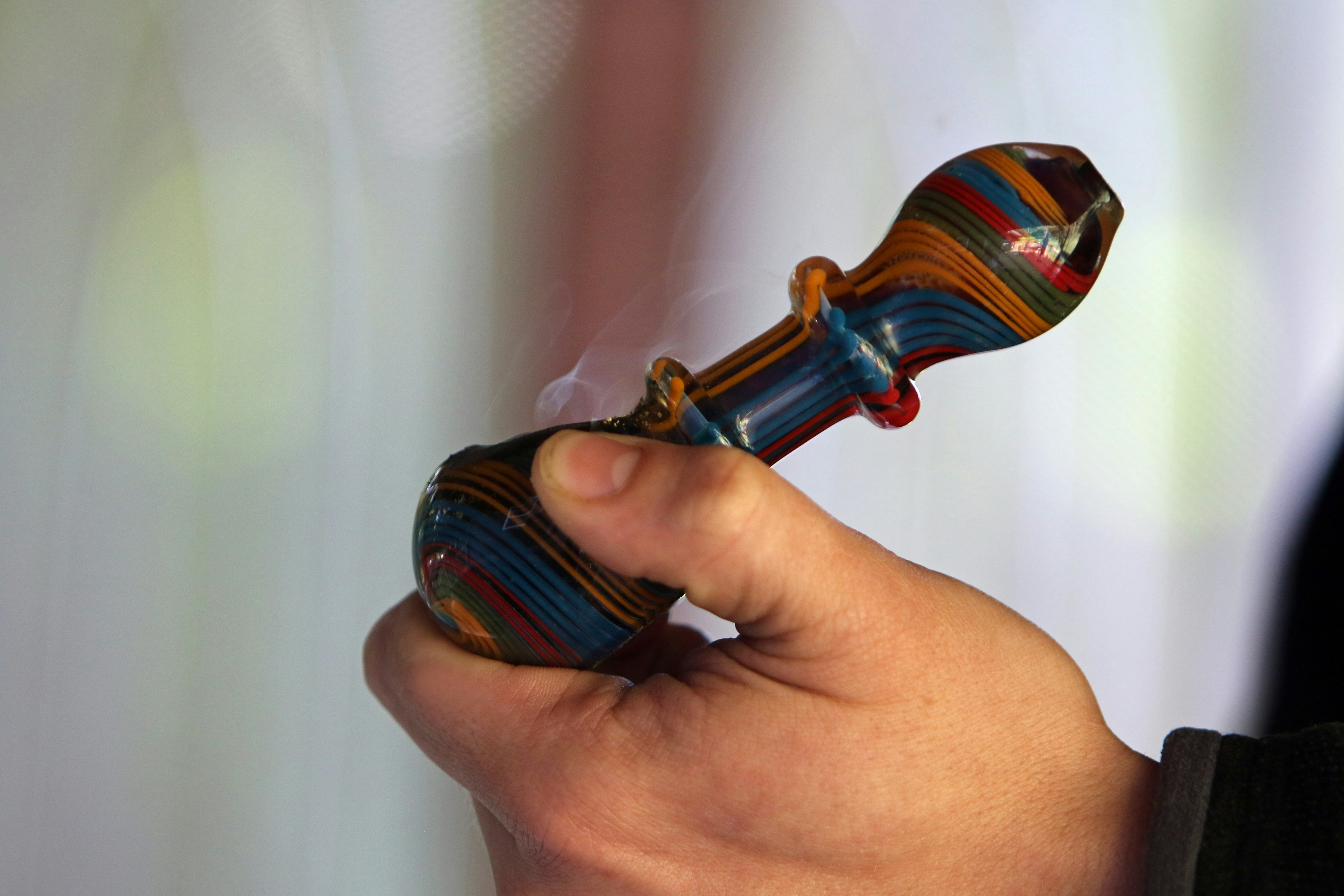 Handcrafted Glass Pipe: A Hand-Held Augustine of Colorful Curves