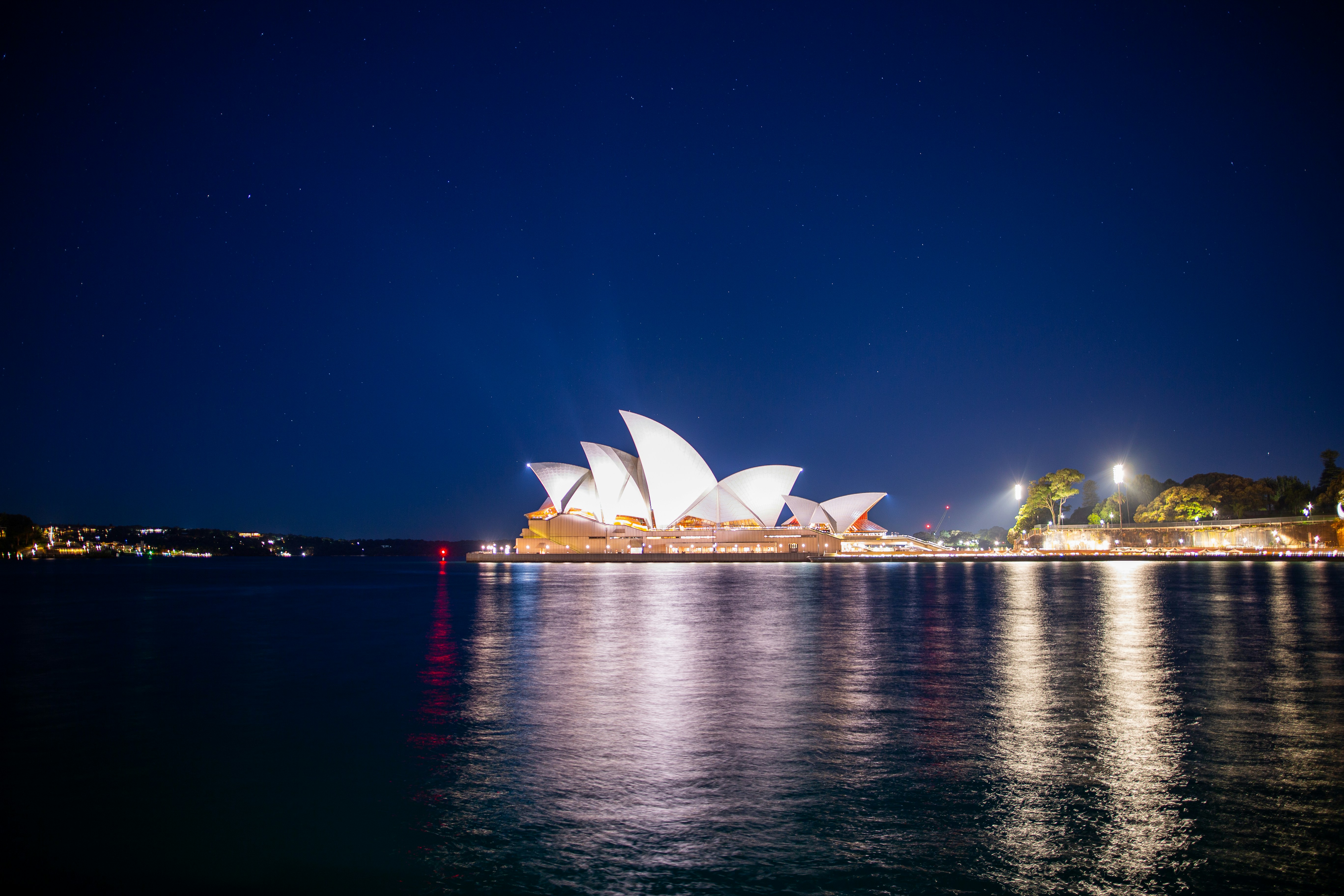The sydney opera house is lit up at night photo – Free Sydney opera ...
