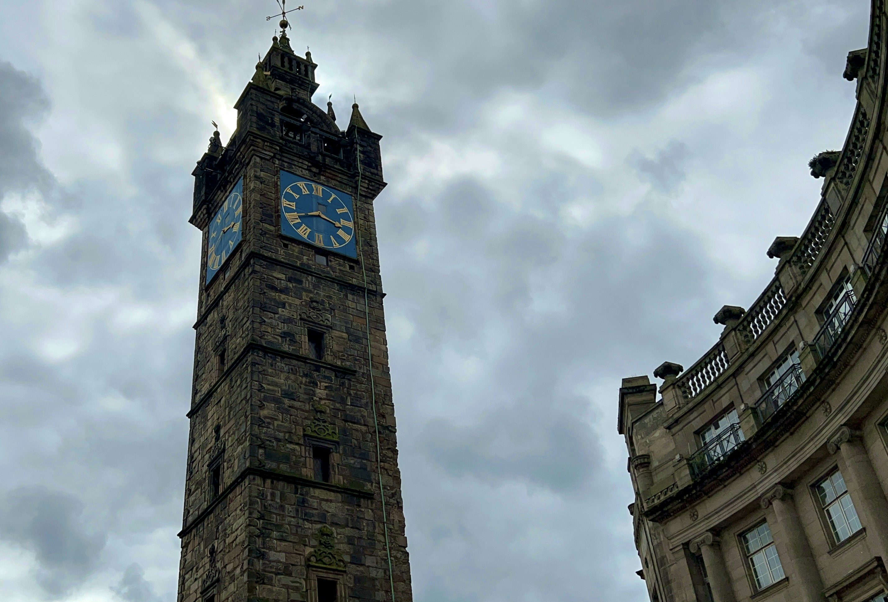 A tall clock tower towering over a city photo – Free High street Image ...