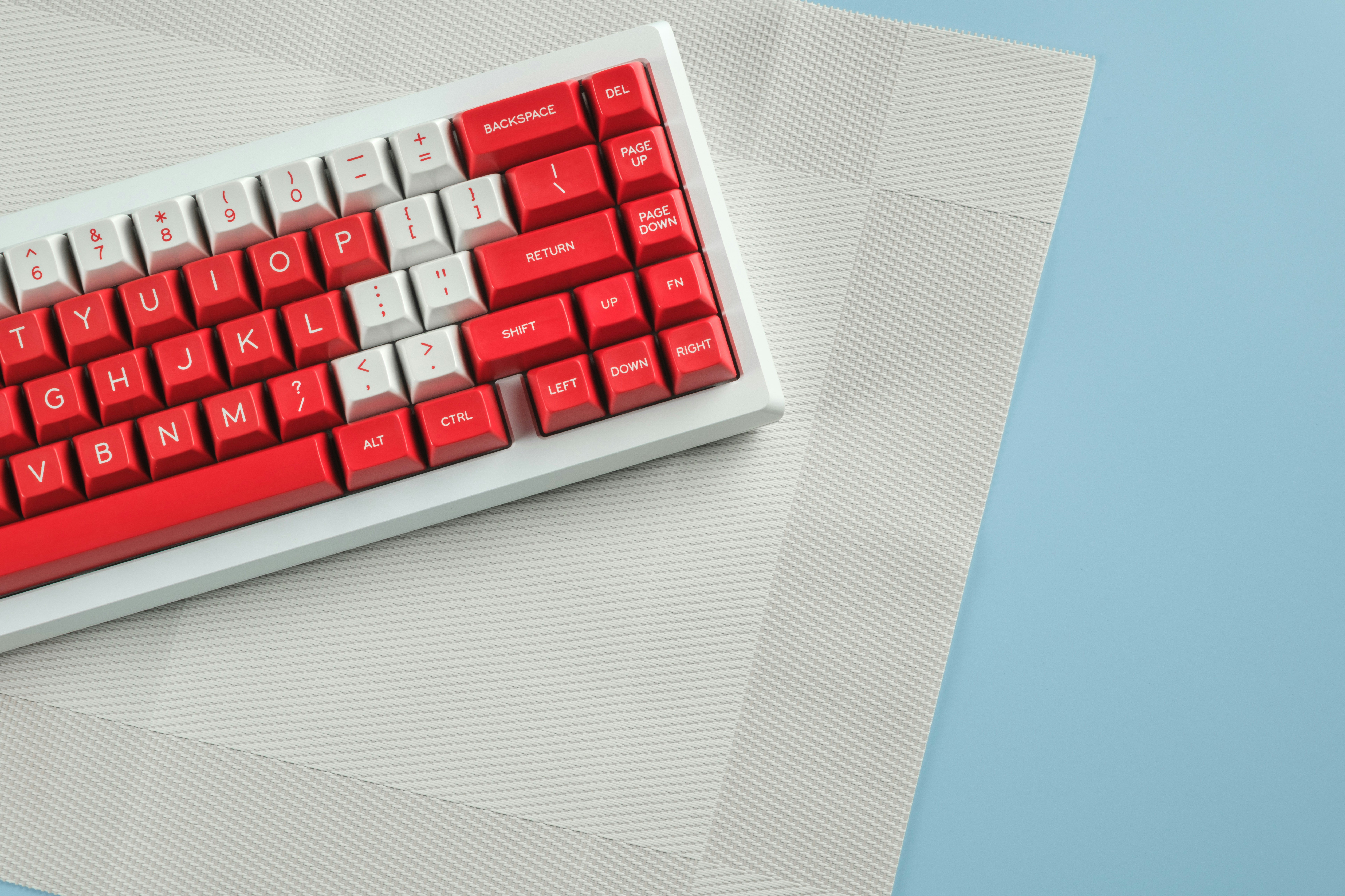 A red and white keyboard sitting on top of a table photo – Free Setup ...
