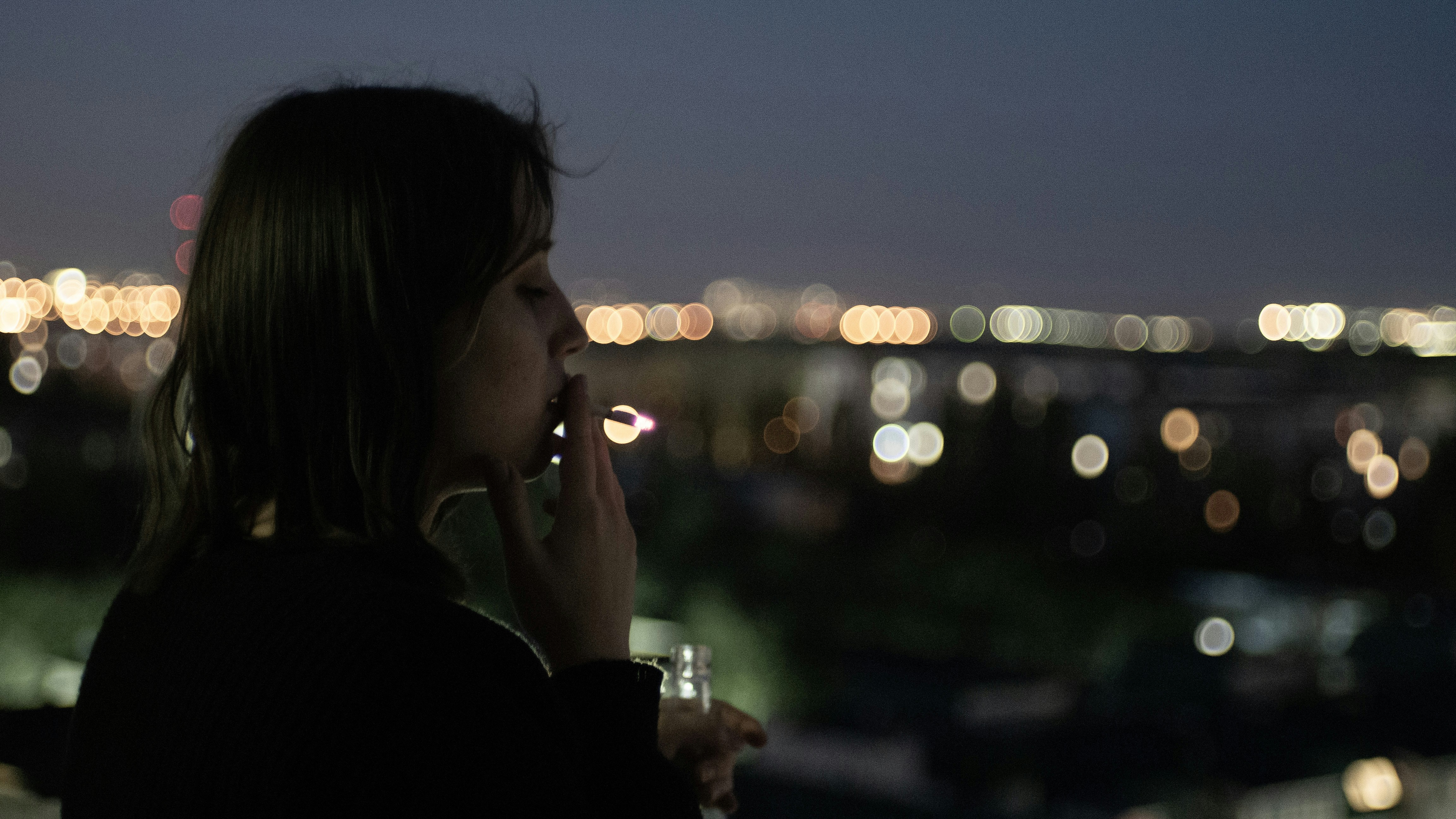 A woman talking on a cell phone at night photo – Free Stavropol Image ...