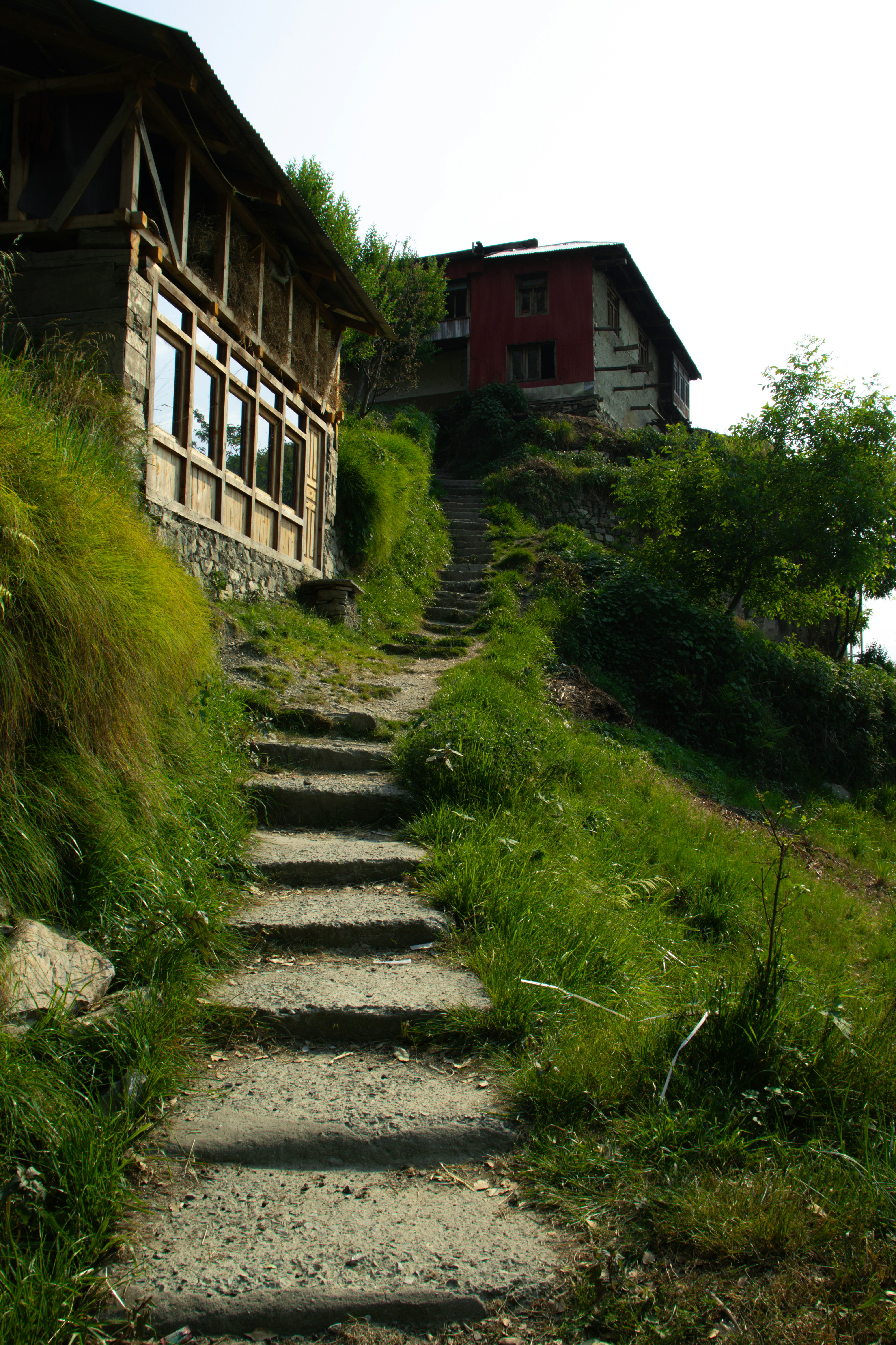 Stone Stairway to a Hilltop Red House