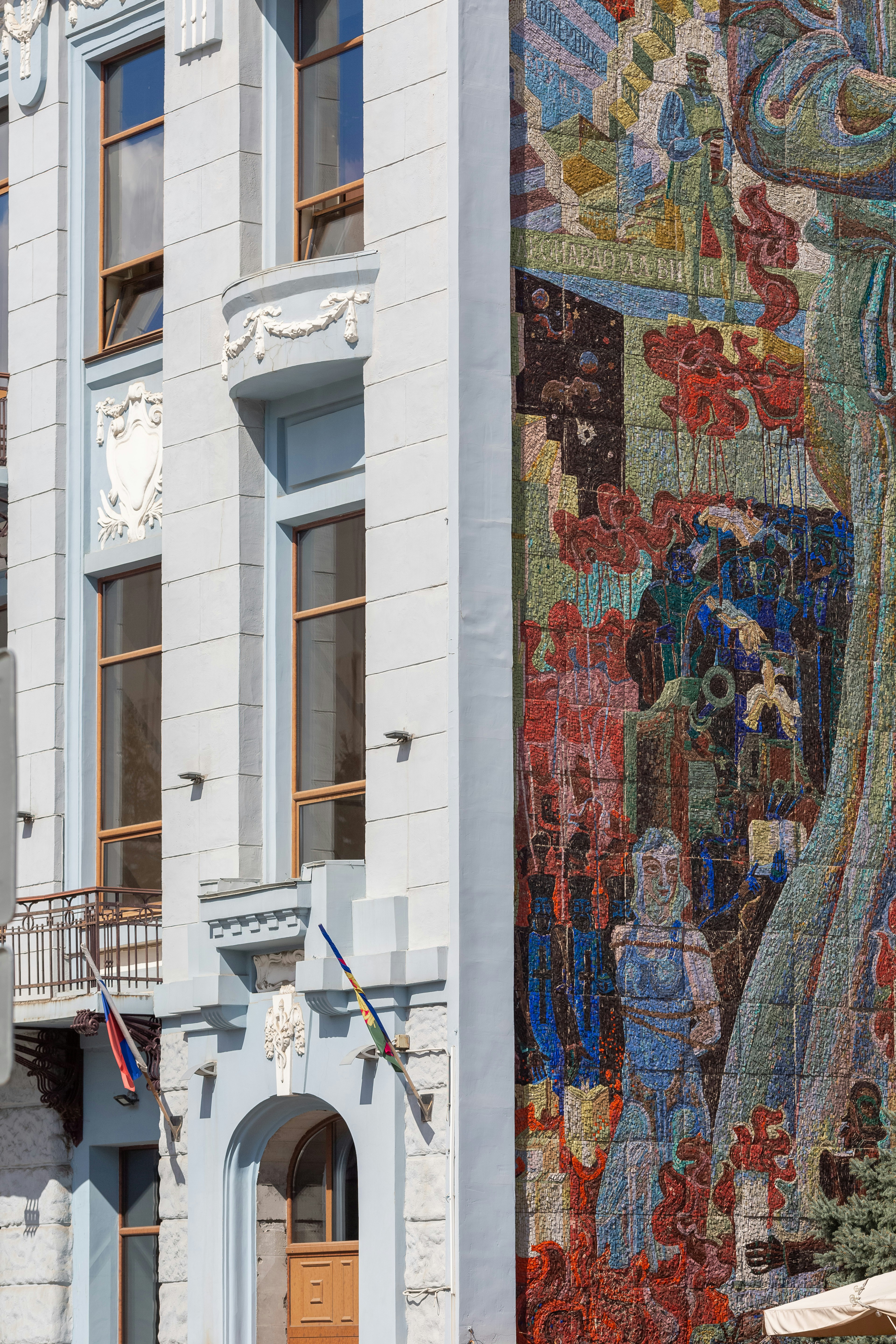 Mosaic Horizon: Colorful Tiles against a Pale Facade