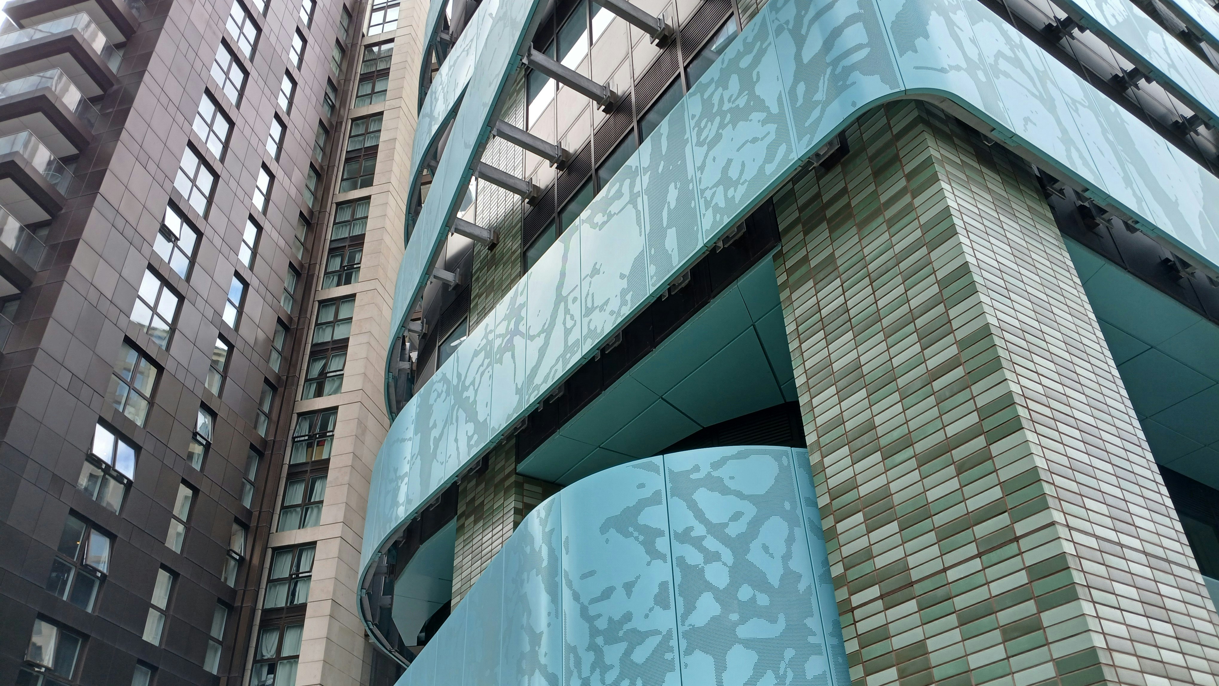 A very tall building next to a very tall building photo – Free City ...
