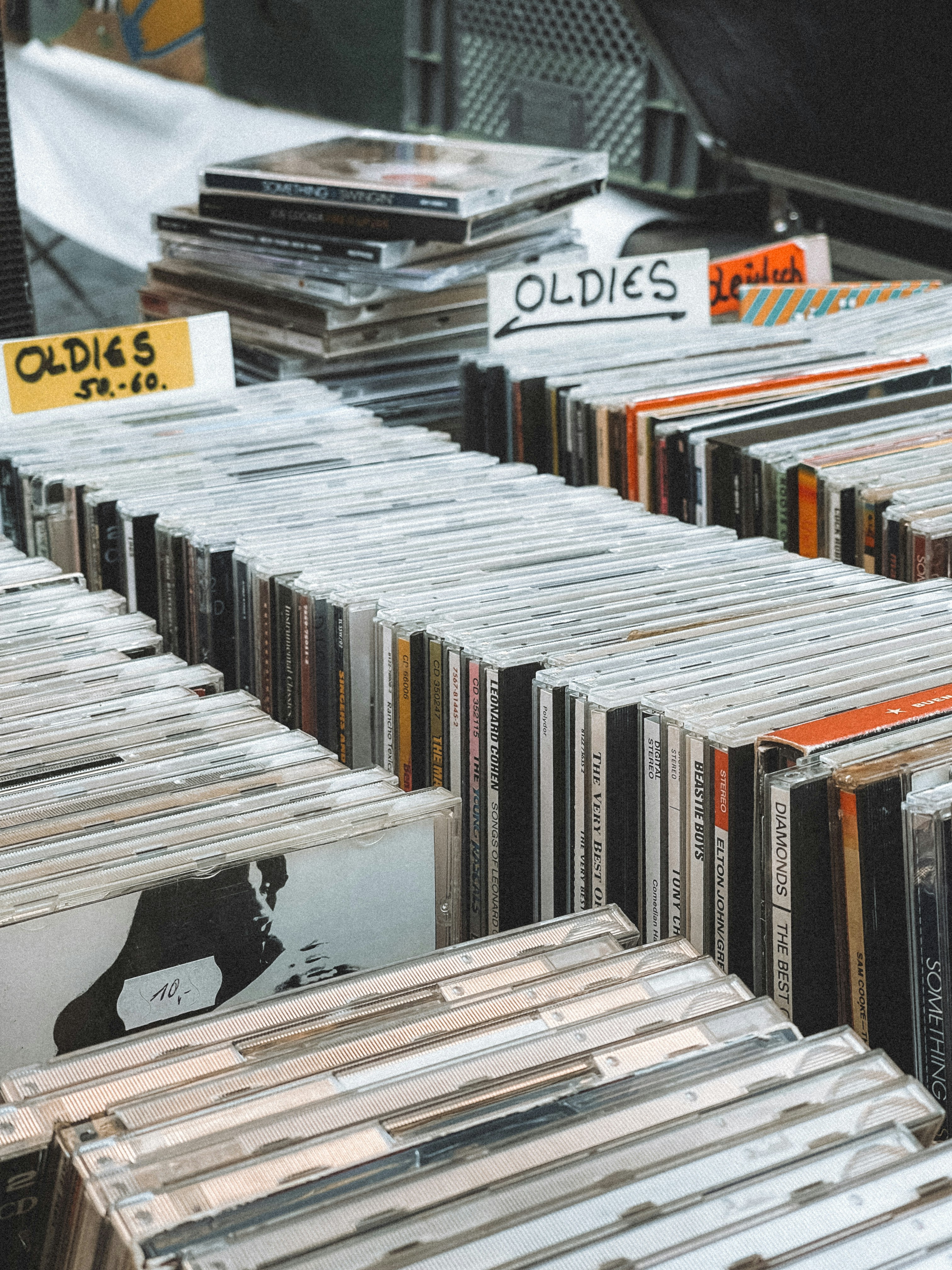 A large collection of cds on a table photo – Free Disk Image on Unsplash