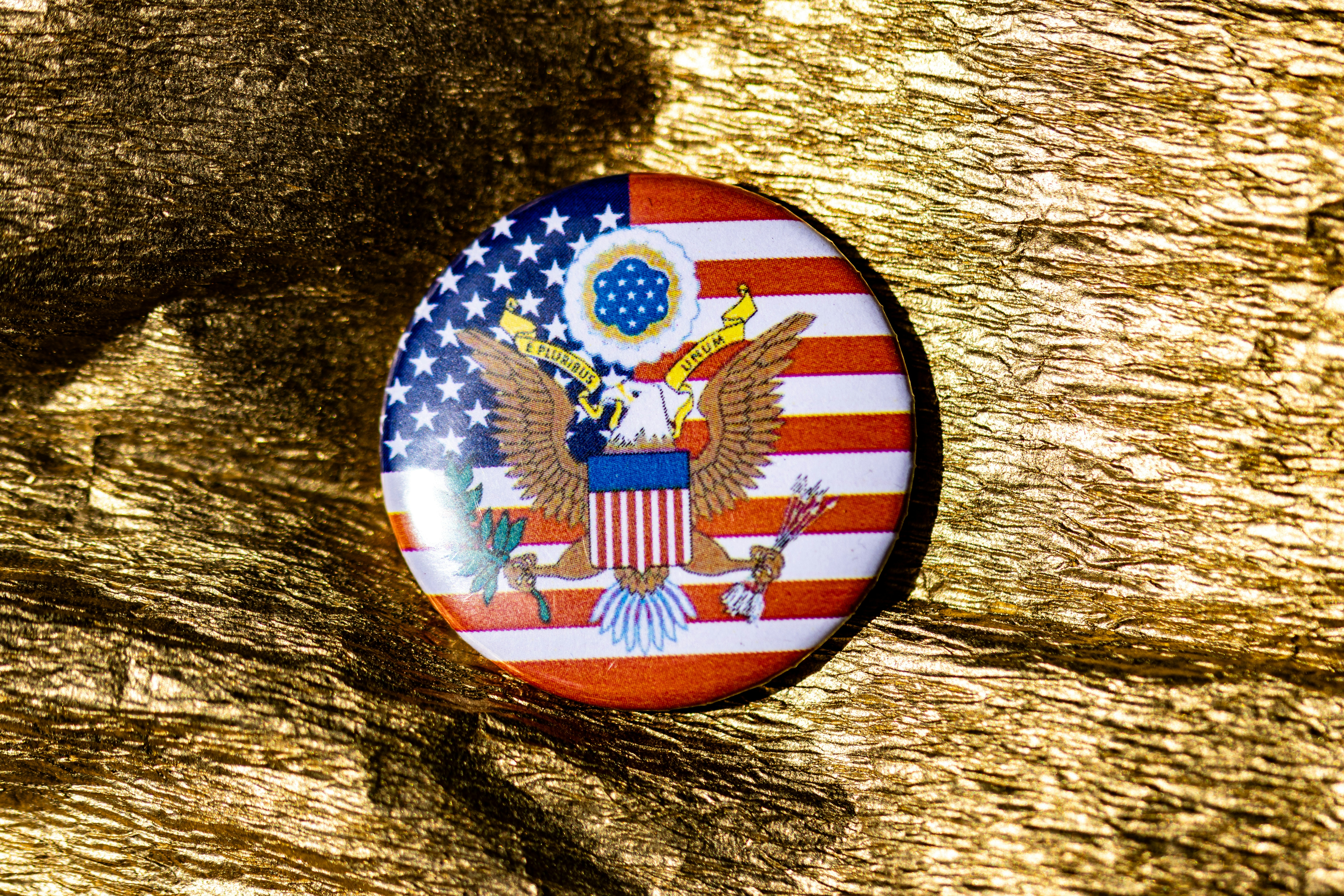 US button on golden background