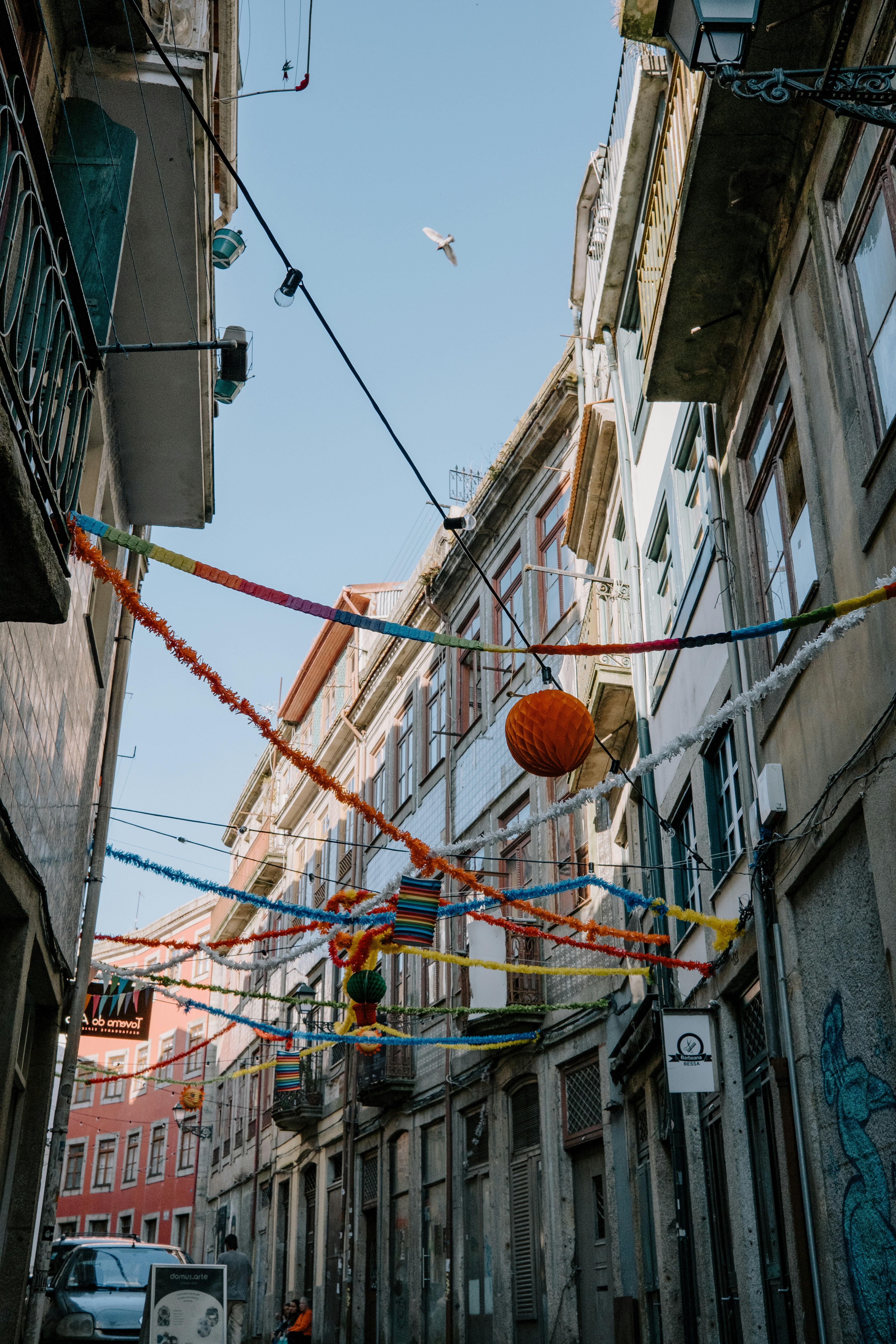 A city street with a bunch of buildings on both sides of it photo ...