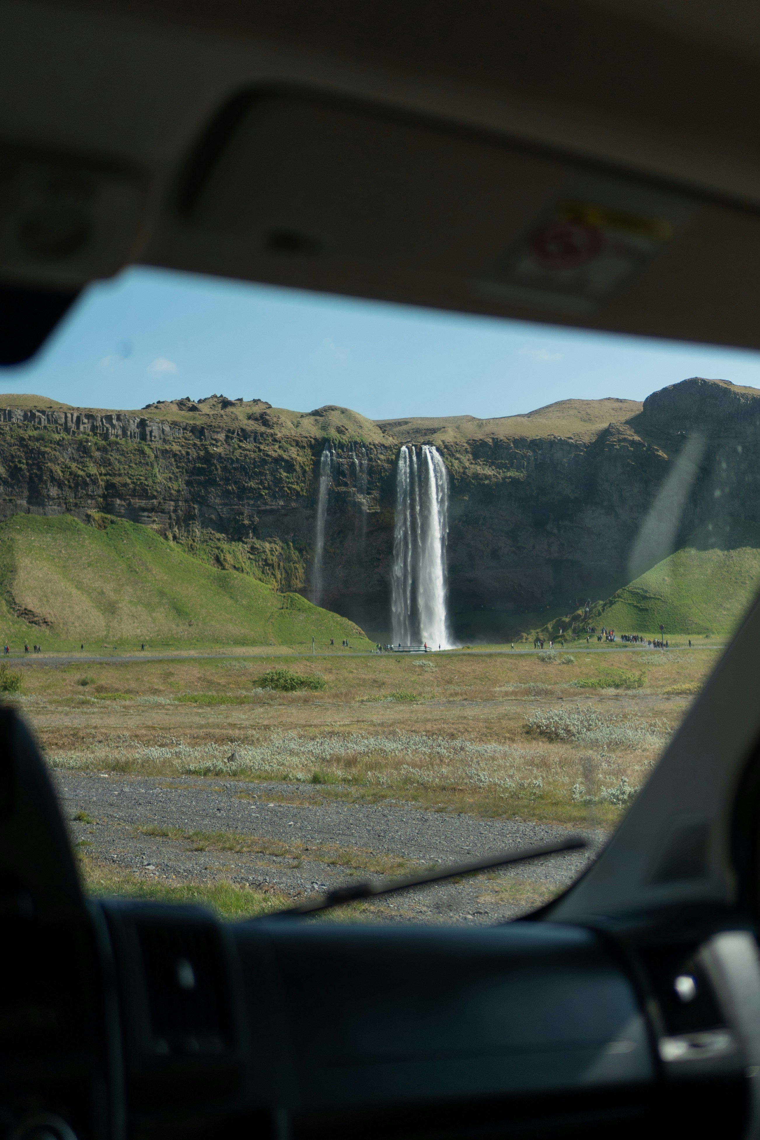 Twin Cascade through a Car Window: Icelandic Falls Framed on the Road