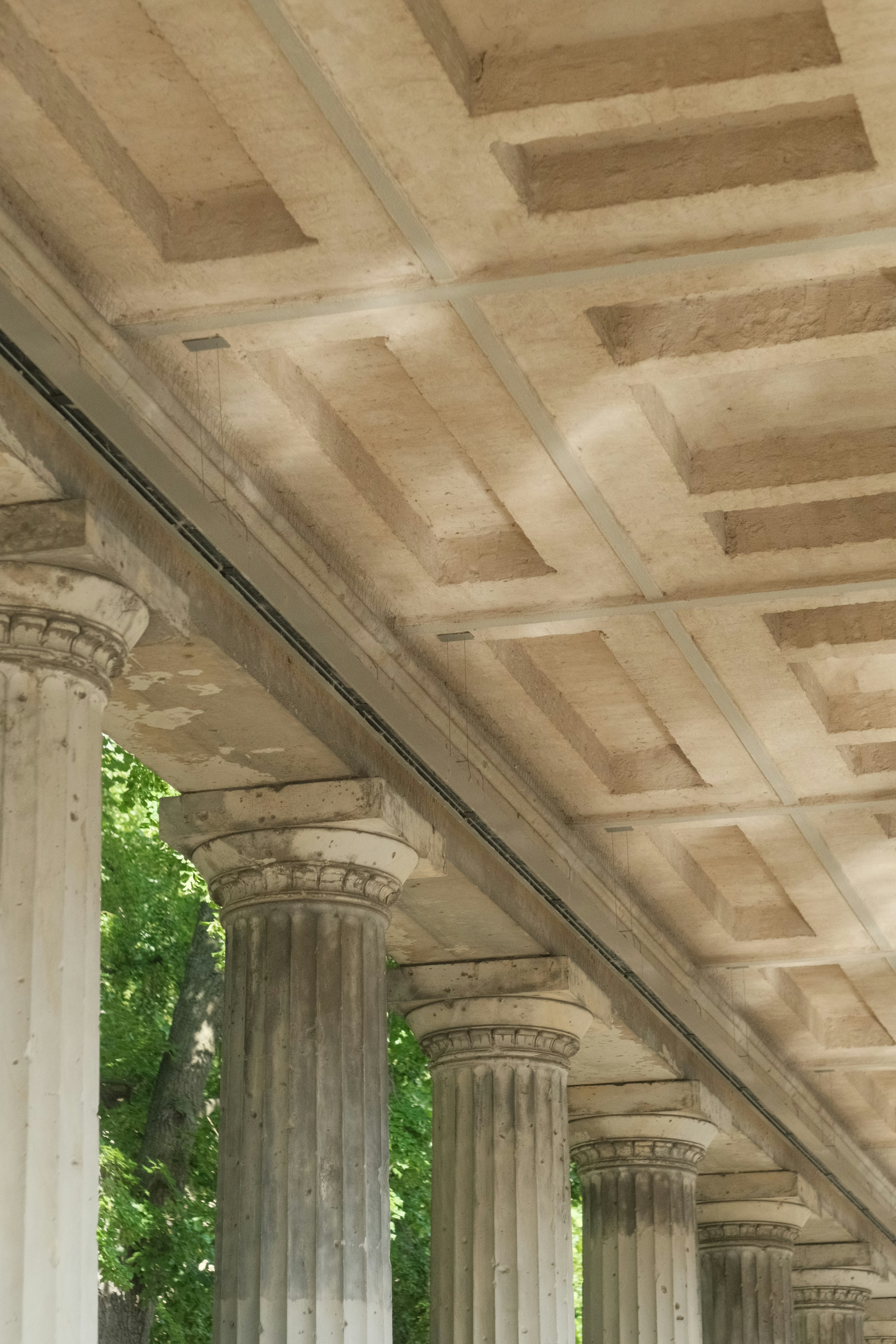 A row of white pillars under a wooden roof photo – Free Reflection ...