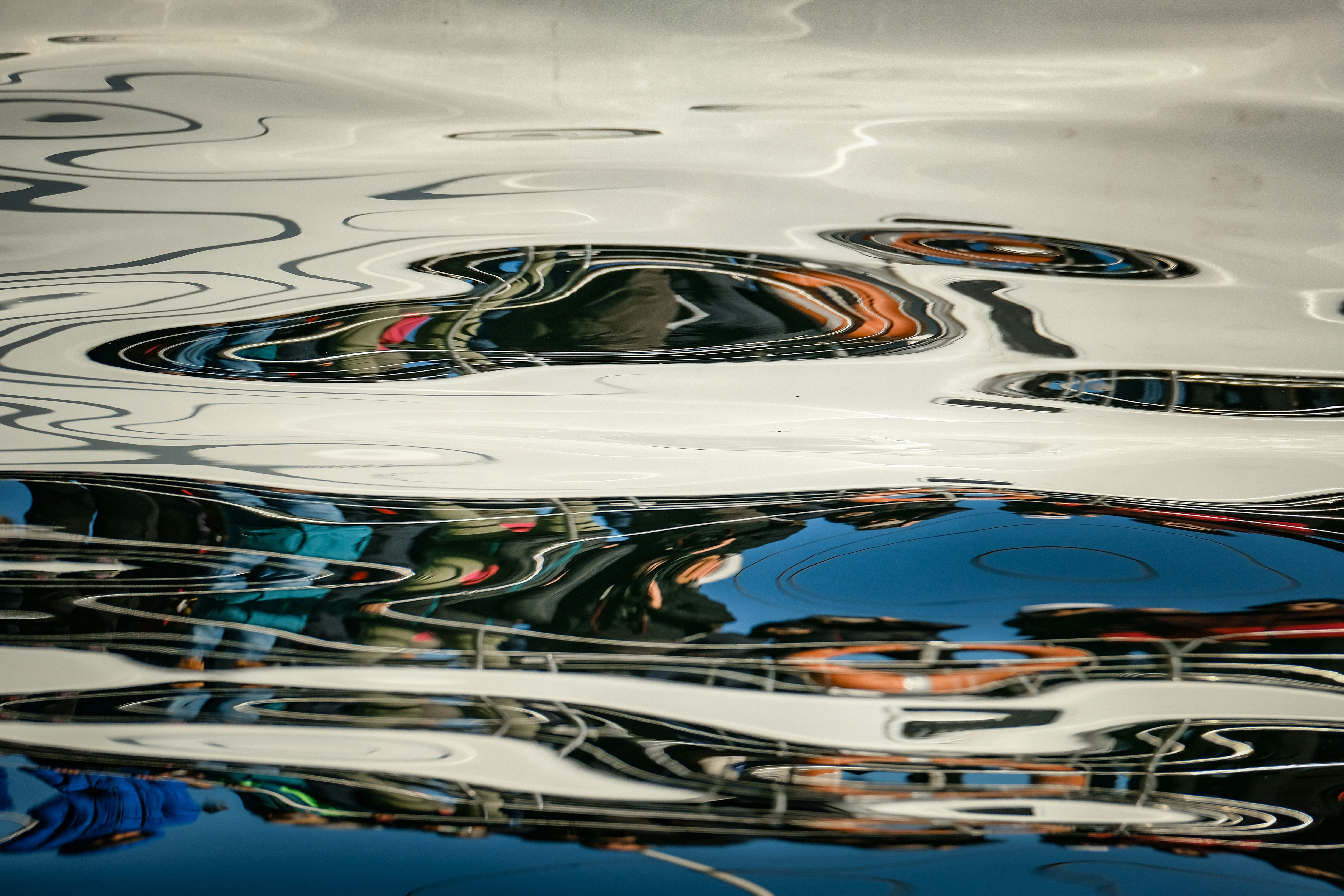 A reflection of a boat in the water photo – Free Ripple Image on Unsplash
