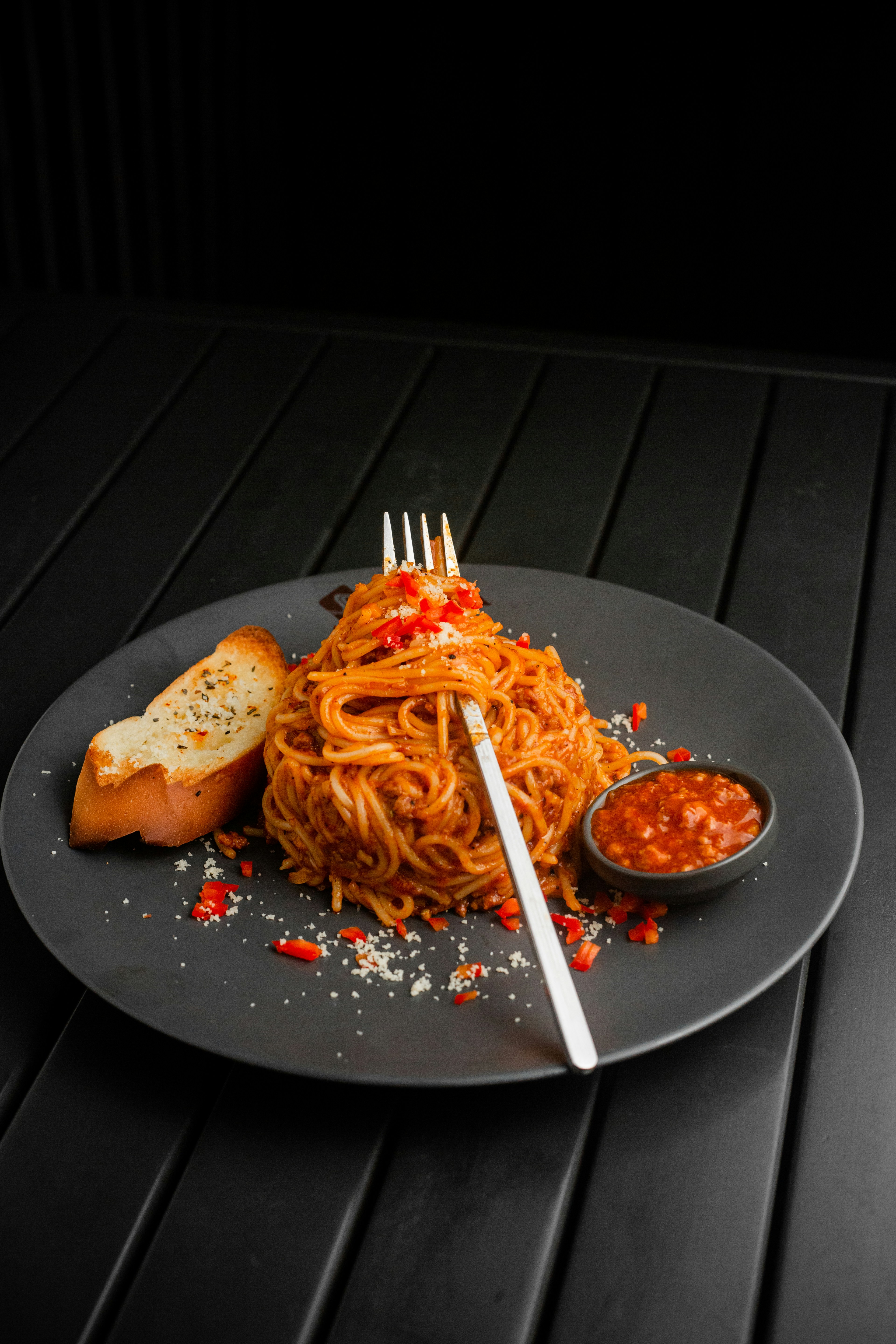 A plate of spaghetti and bread on a table photo – Free Sony Image on ...
