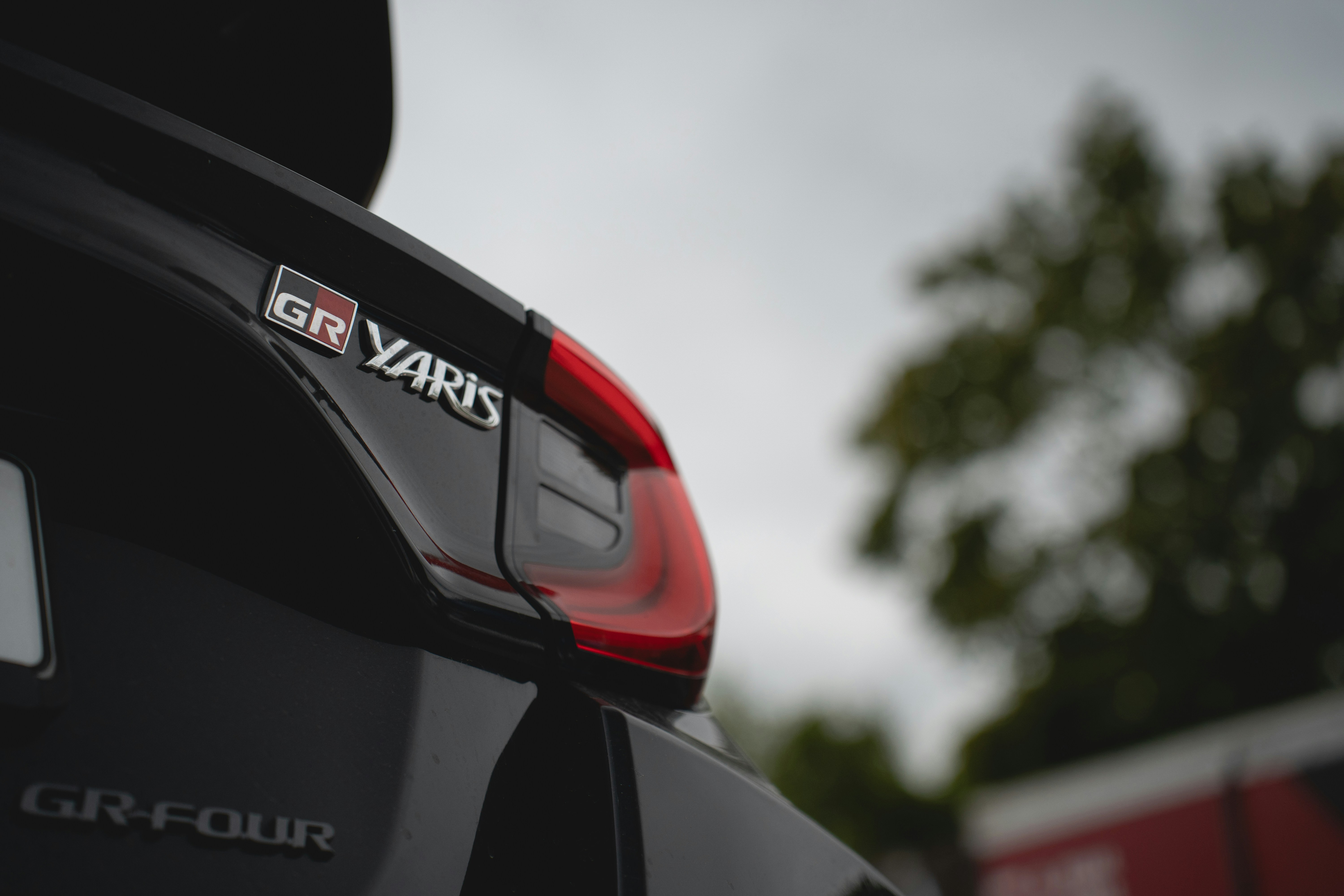 A close up of the rear end of a car photo – Free Cloudy weather Image ...