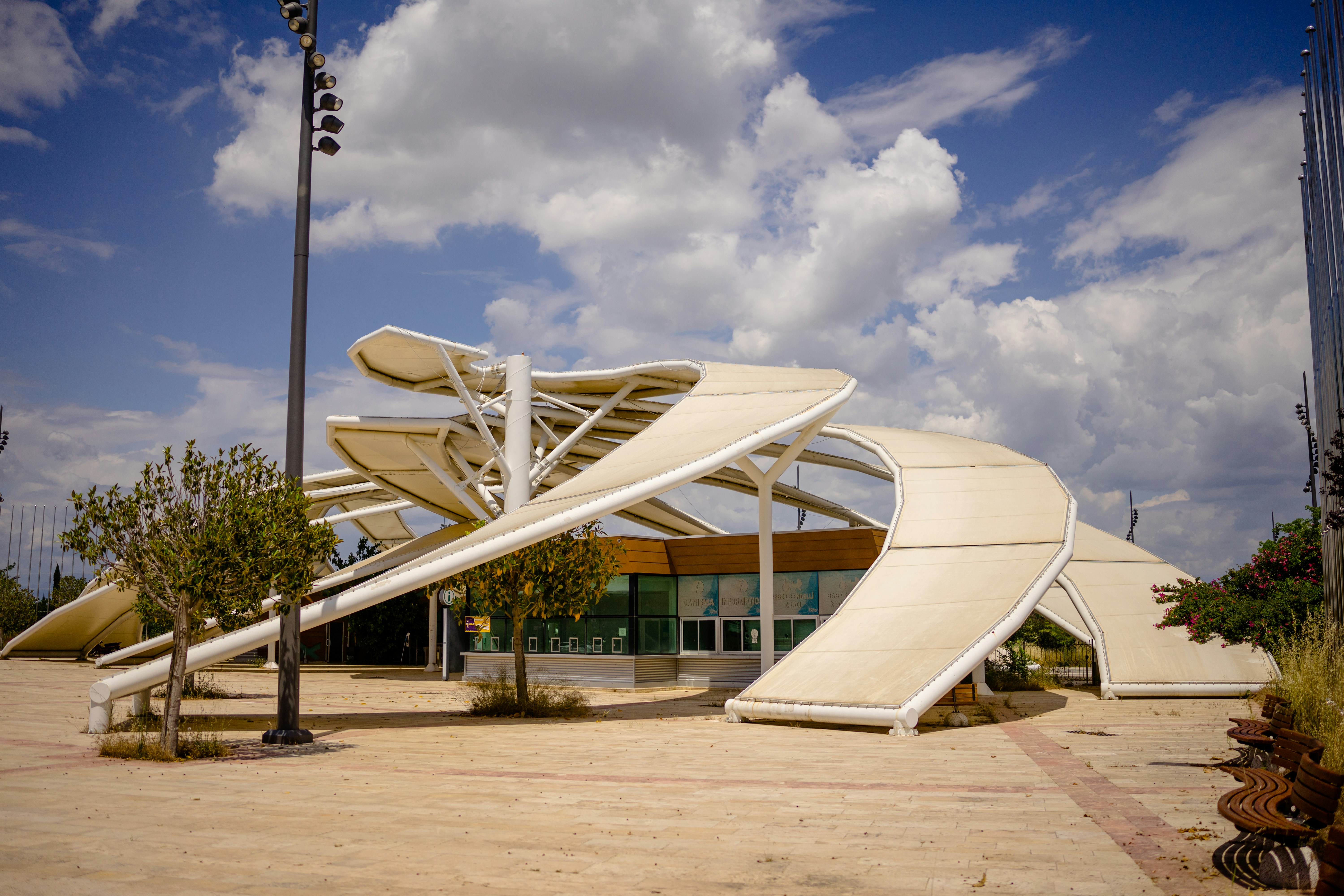 Architectural Whirlwind Under a Cloud-Kissed Sky