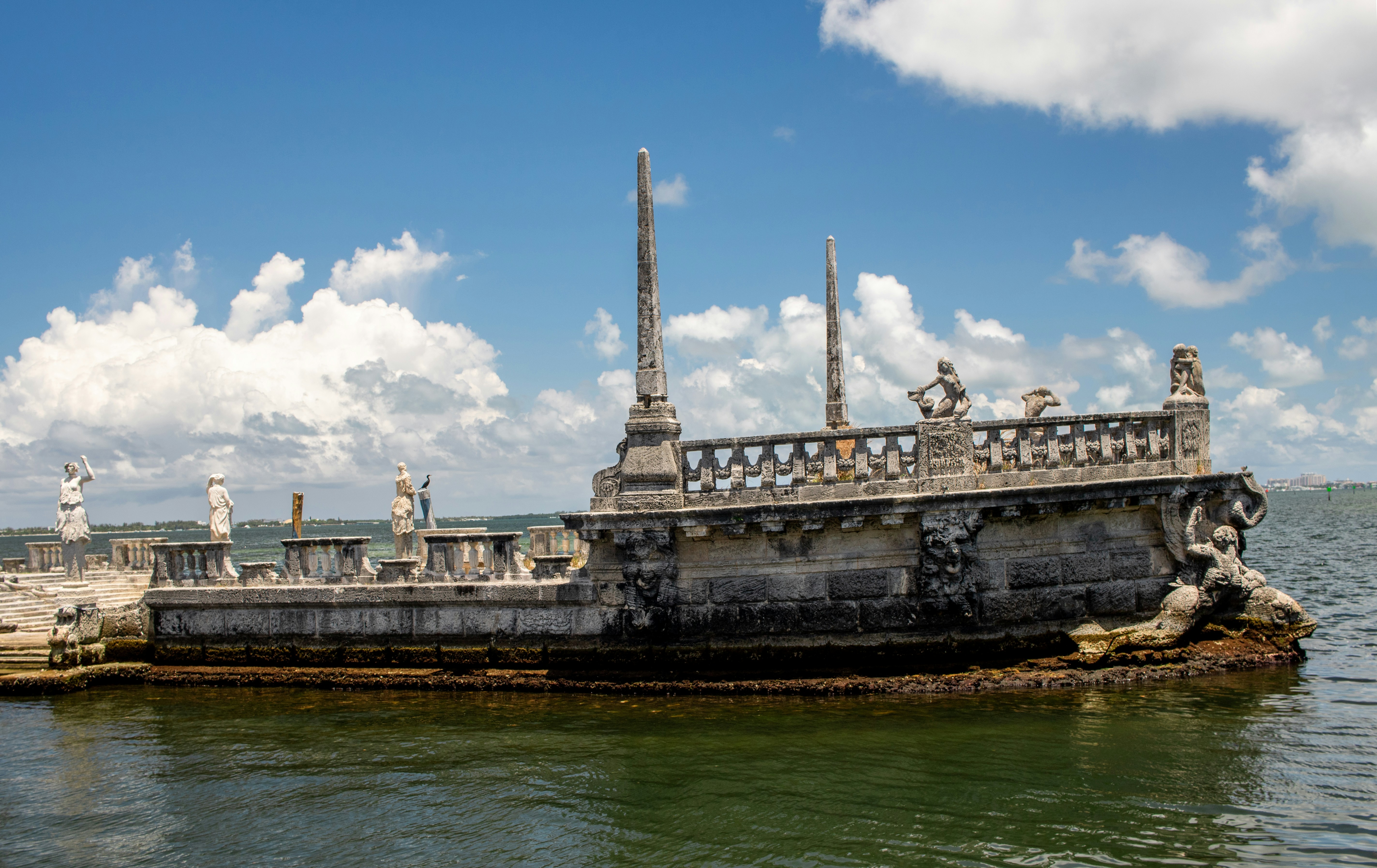 Promenade of Stone Guardians Over Quiet Seawater