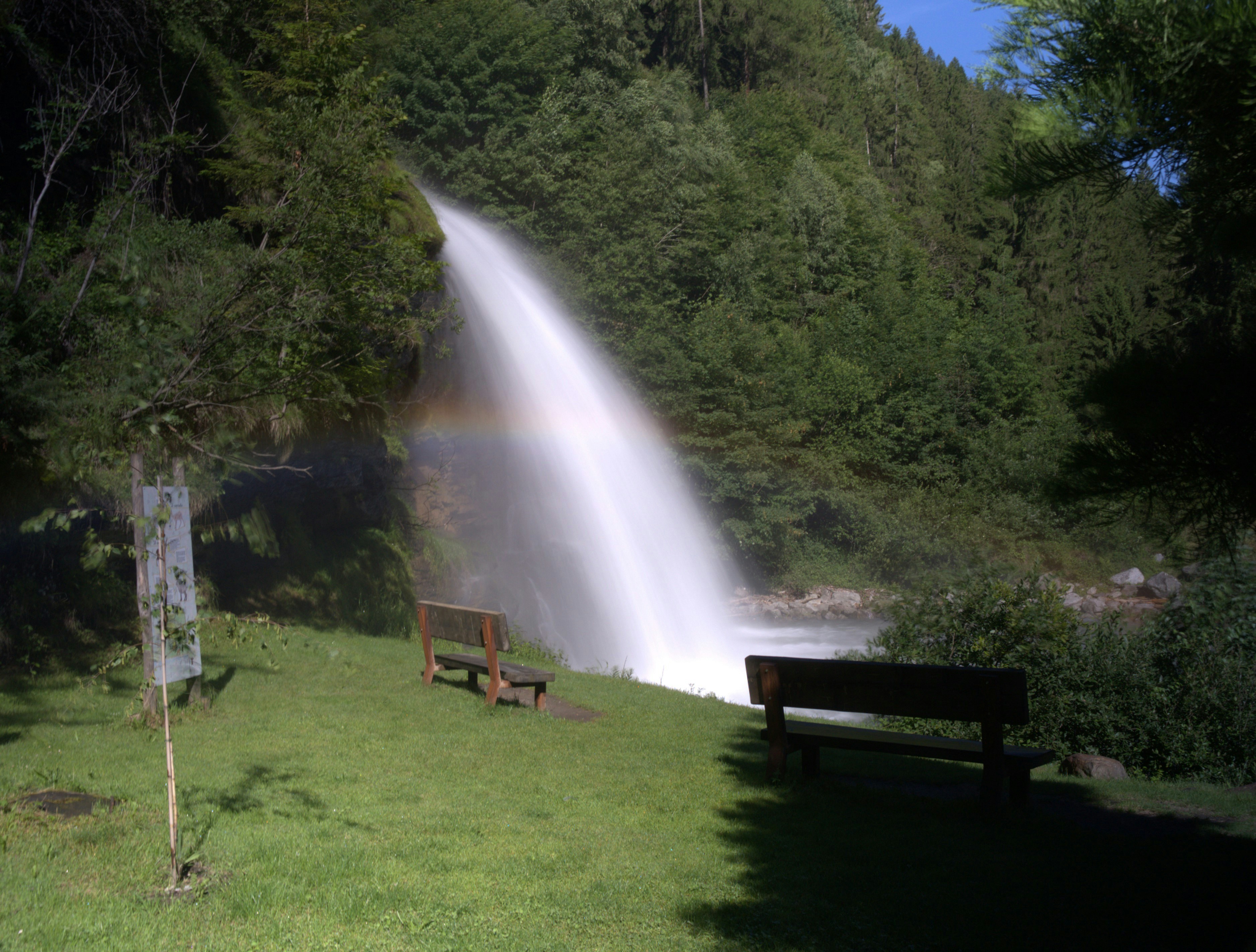 A fire hydrant spewing water onto a hillside photo – Free Switzerland ...