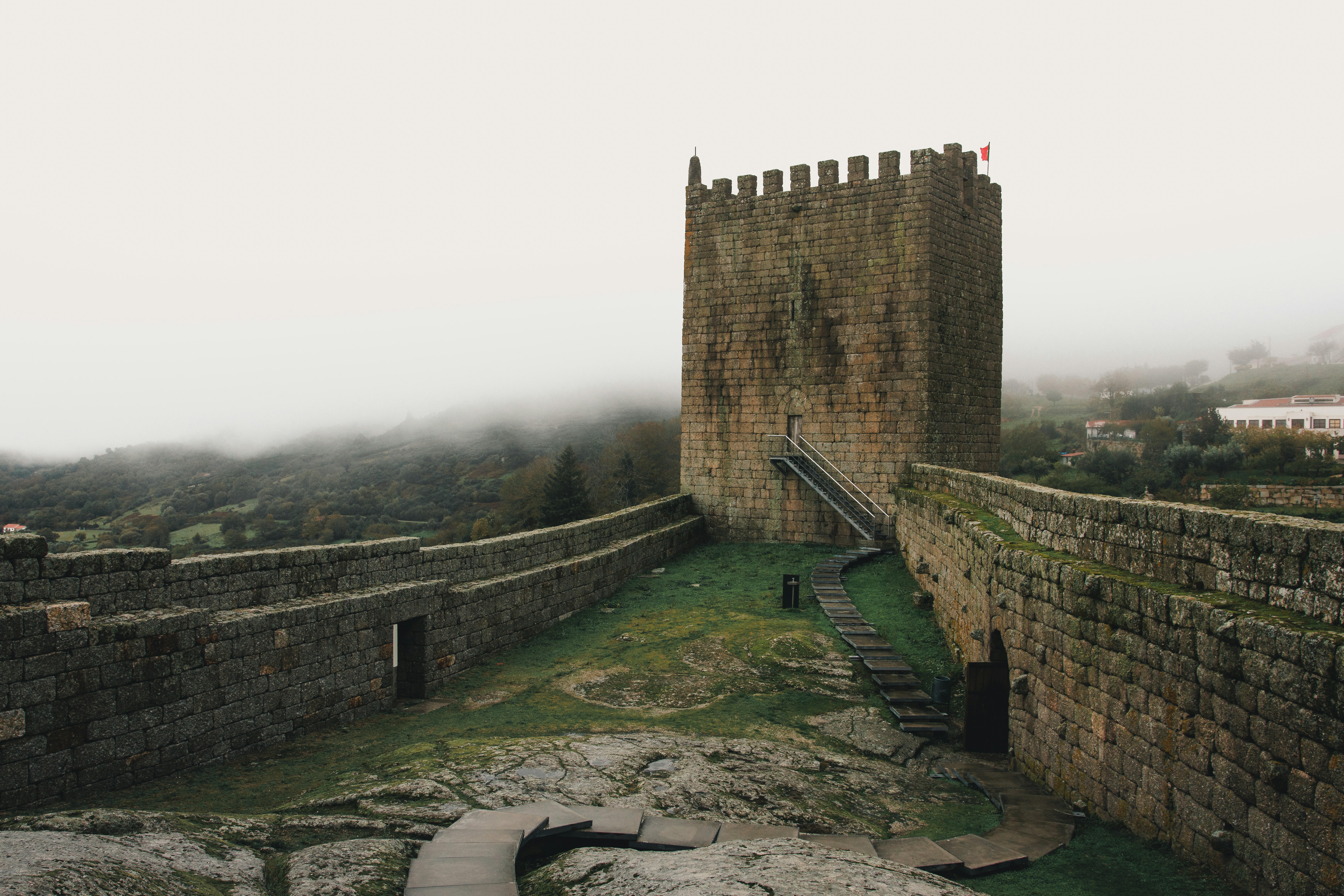 A stone castle with a ramp leading to it photo – Free Portugal Image on ...