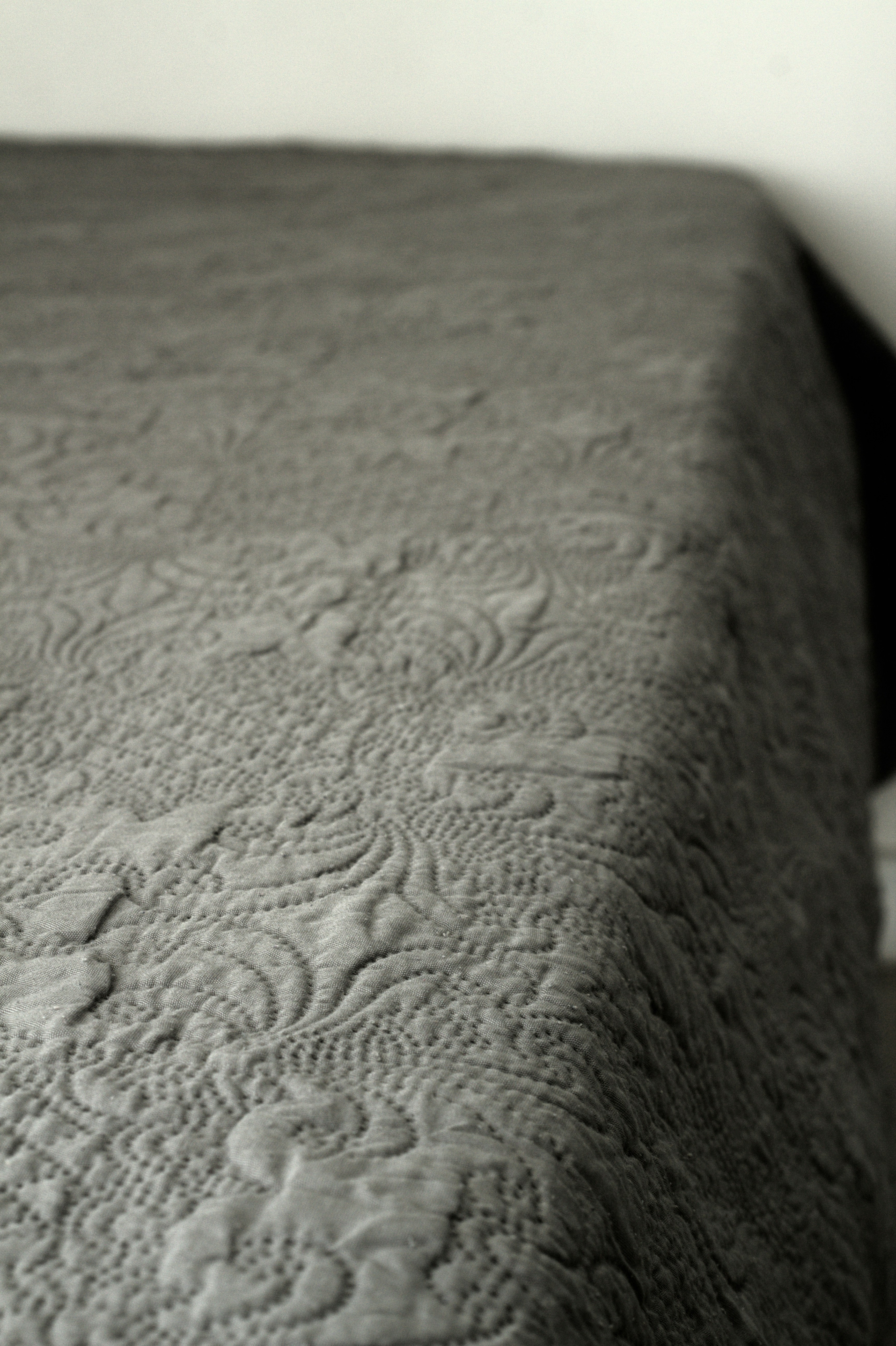 A black and white photo of a bed with a comforter photo – Free Texture ...