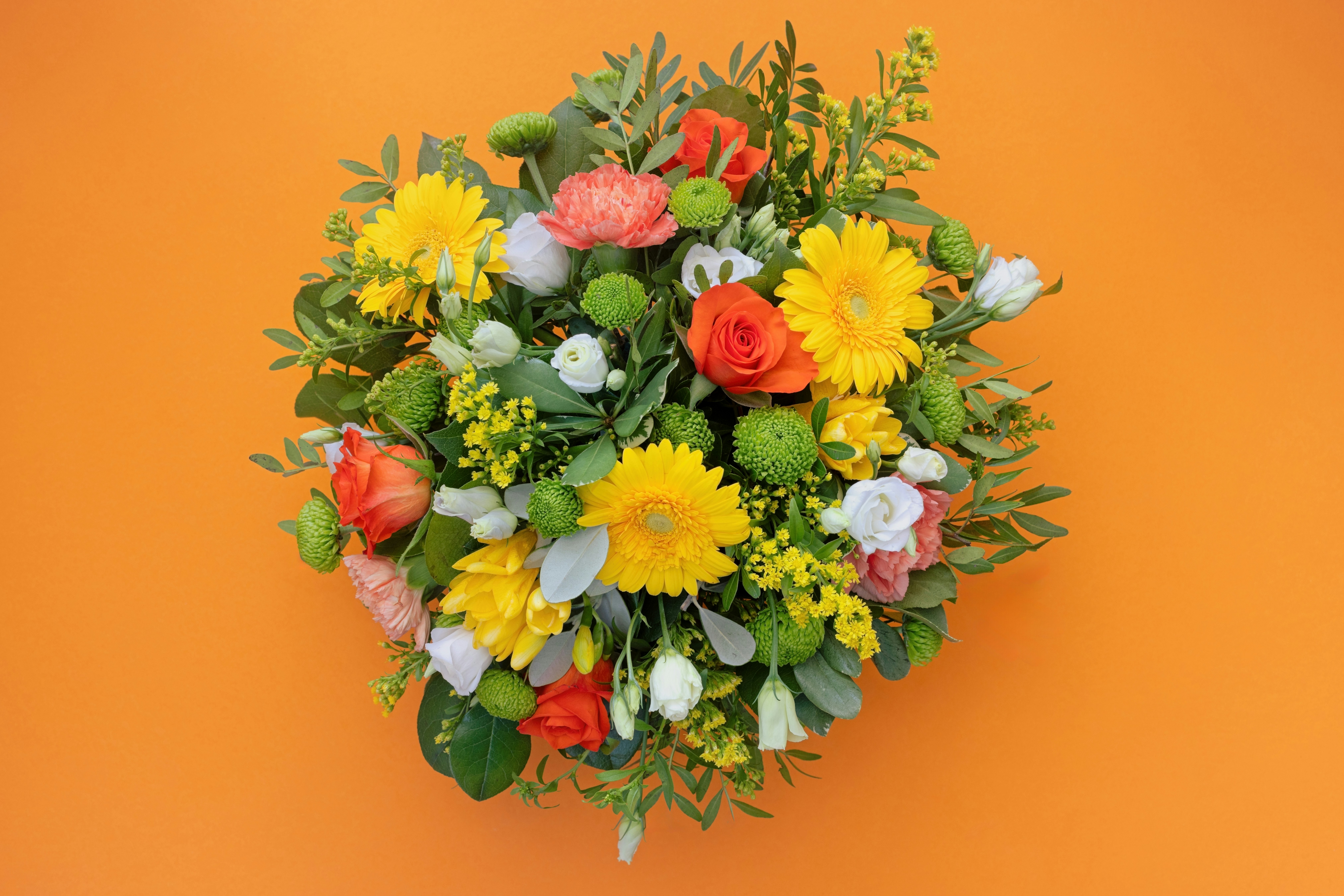 Citrus Bloom Centerpiece: A Burst of Color on Orange