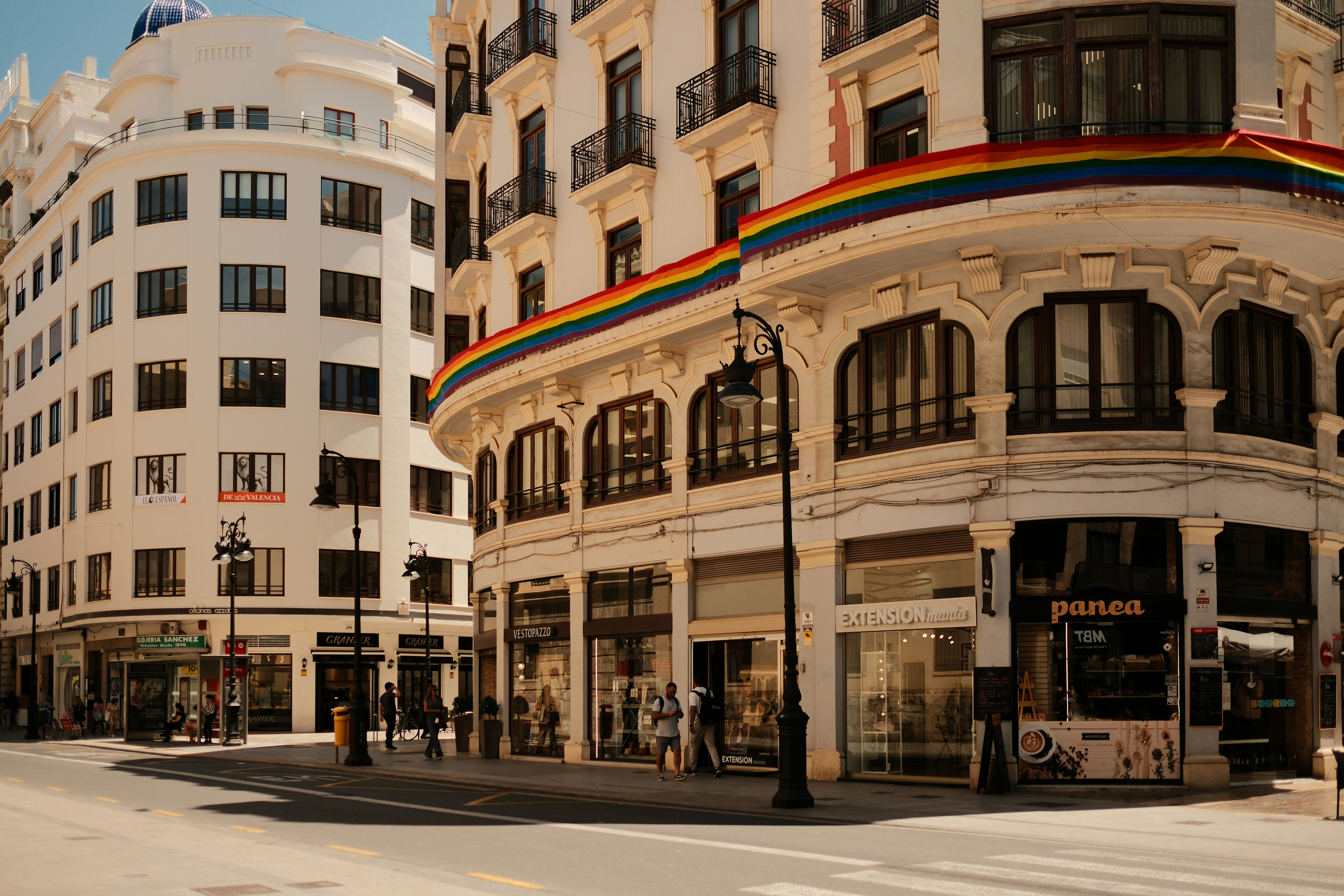 A large building with a rainbow painted on the side of it photo – Free ...