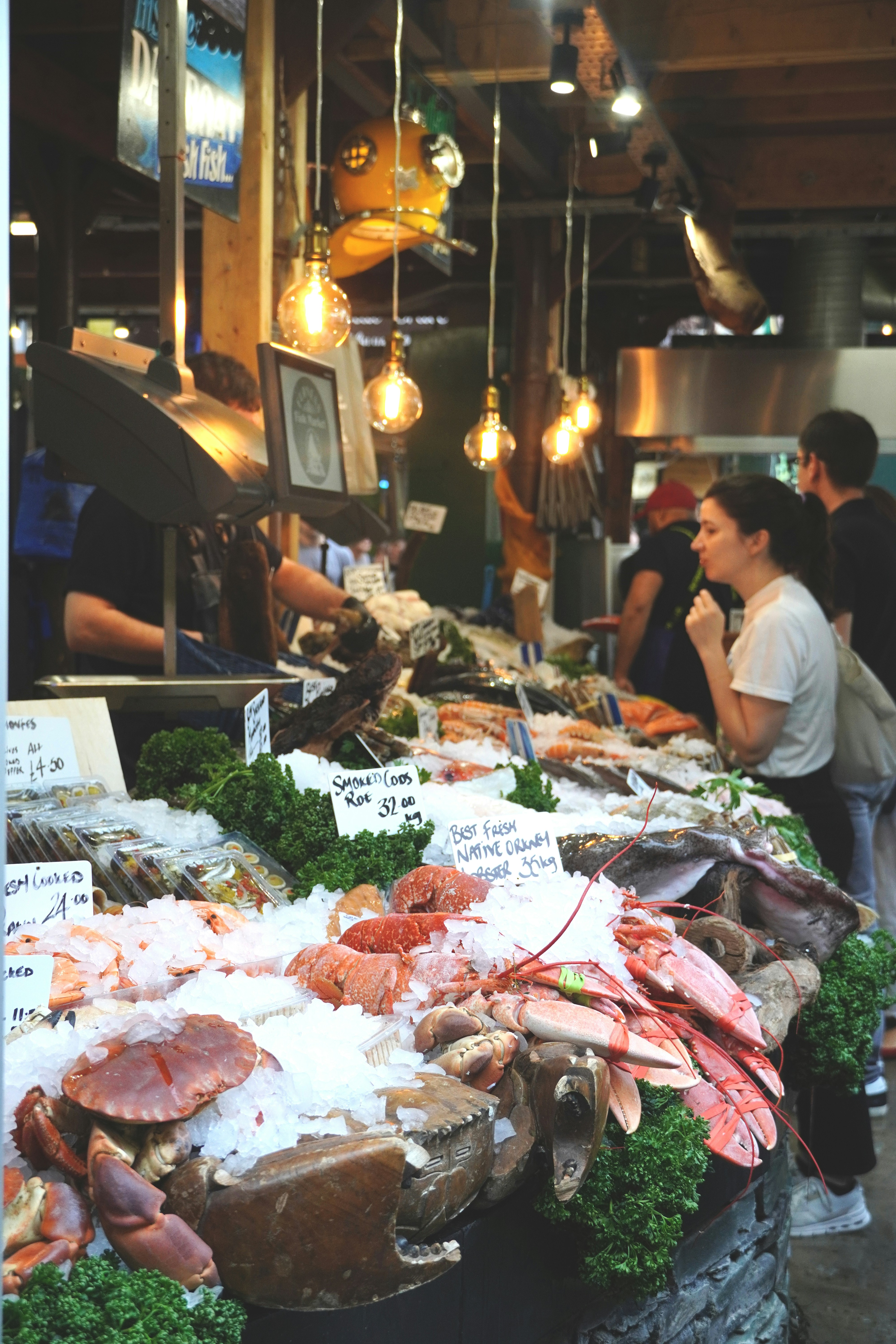 Market Crustacean Parade: Fresh Catch Under Warm Edison Glow