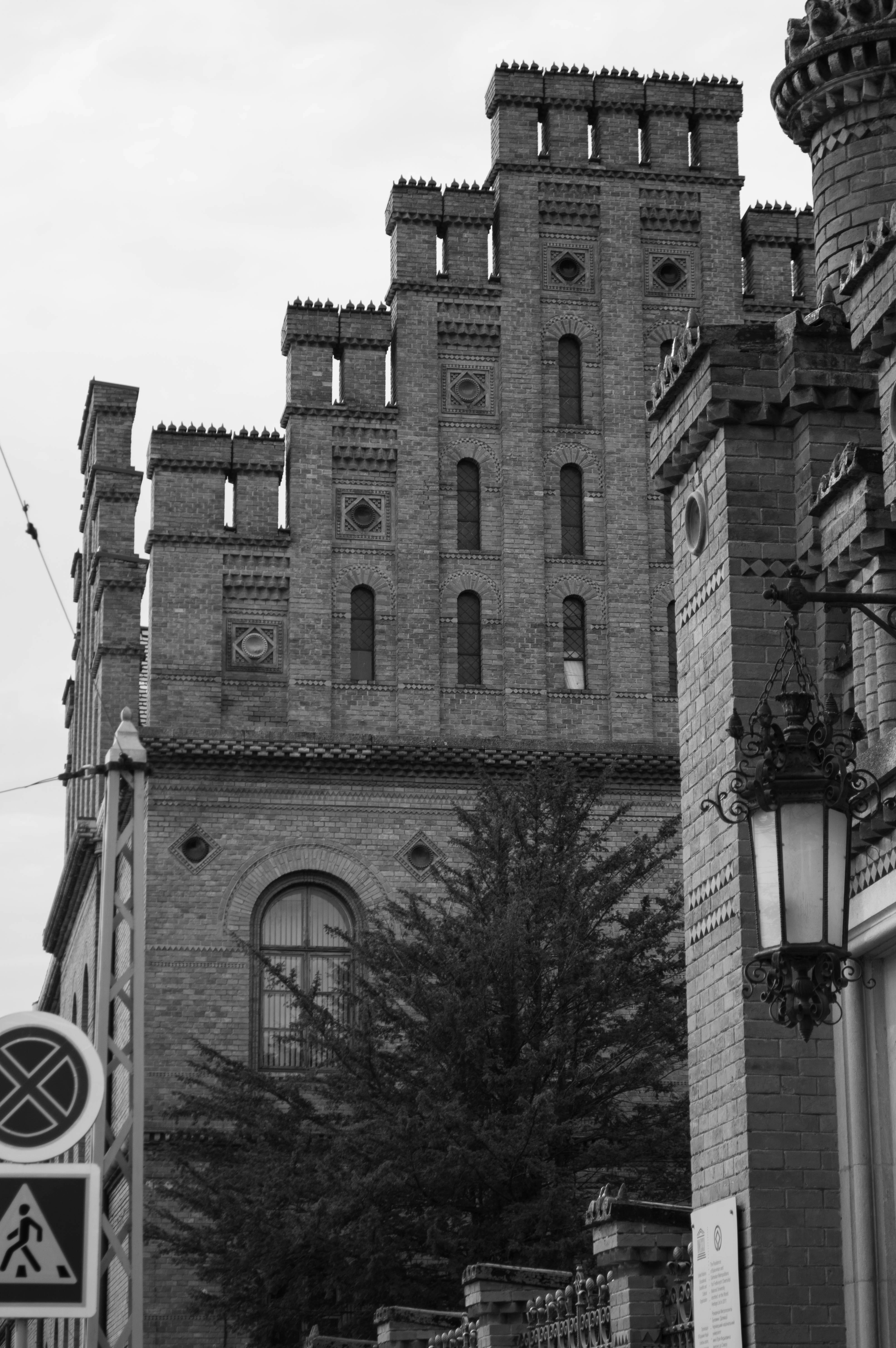 Urban Citadel: The Castellated Brick Facade in Monochrome