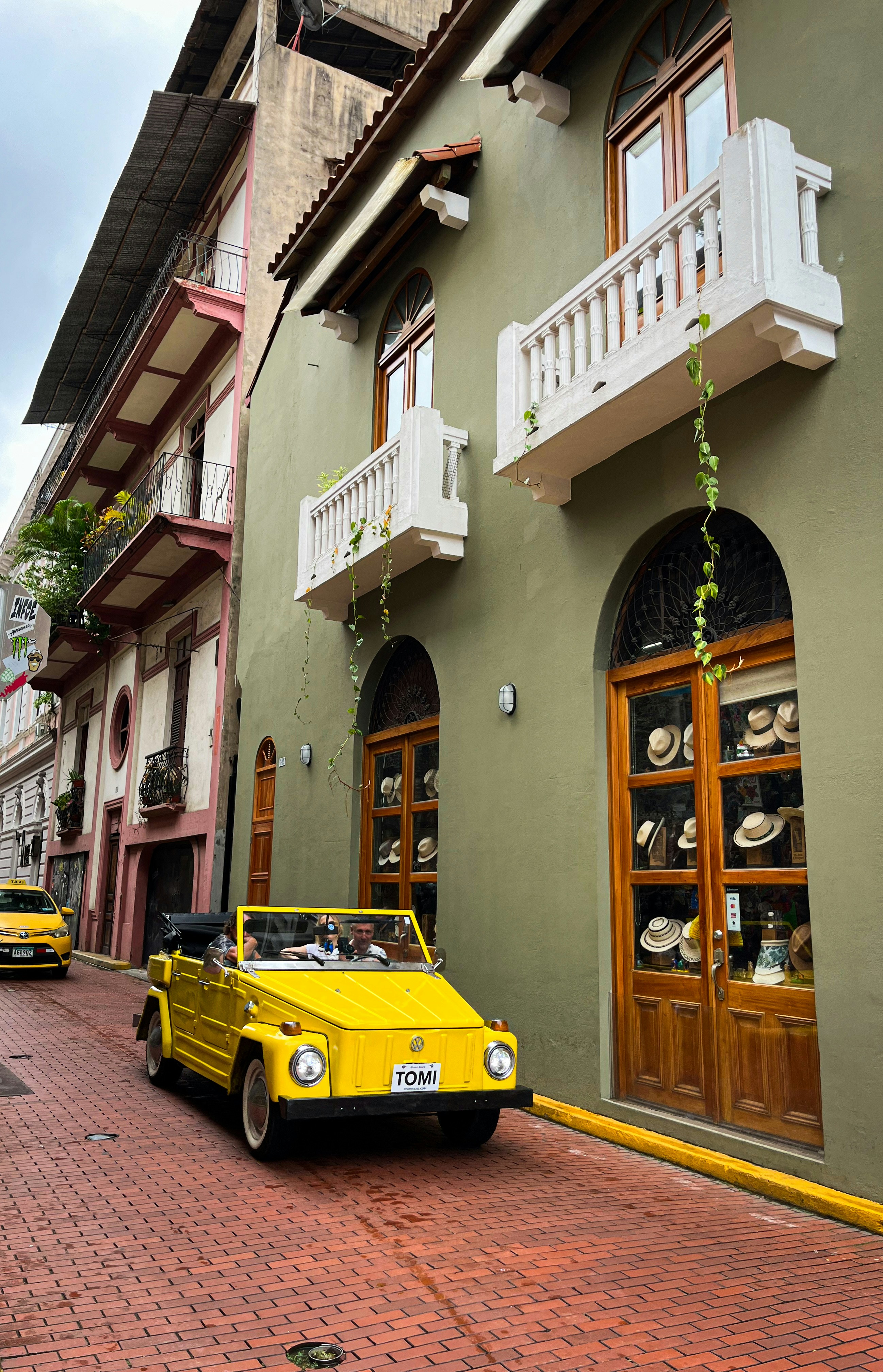 This is TOMI. A yellow car on a street in Casco Viejo, Panama.