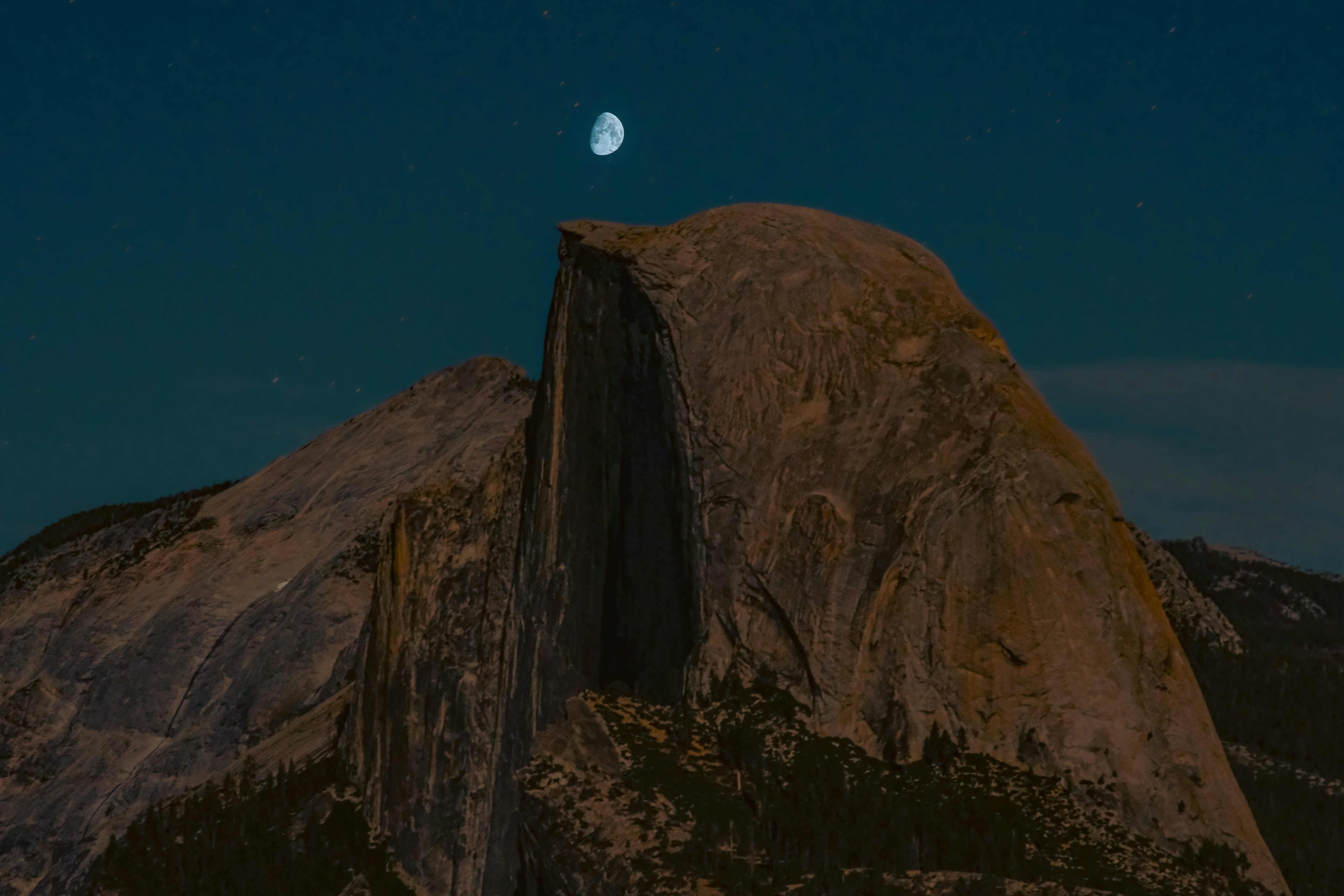 The moon is setting over a mountain peak photo – Free Half dome Image ...