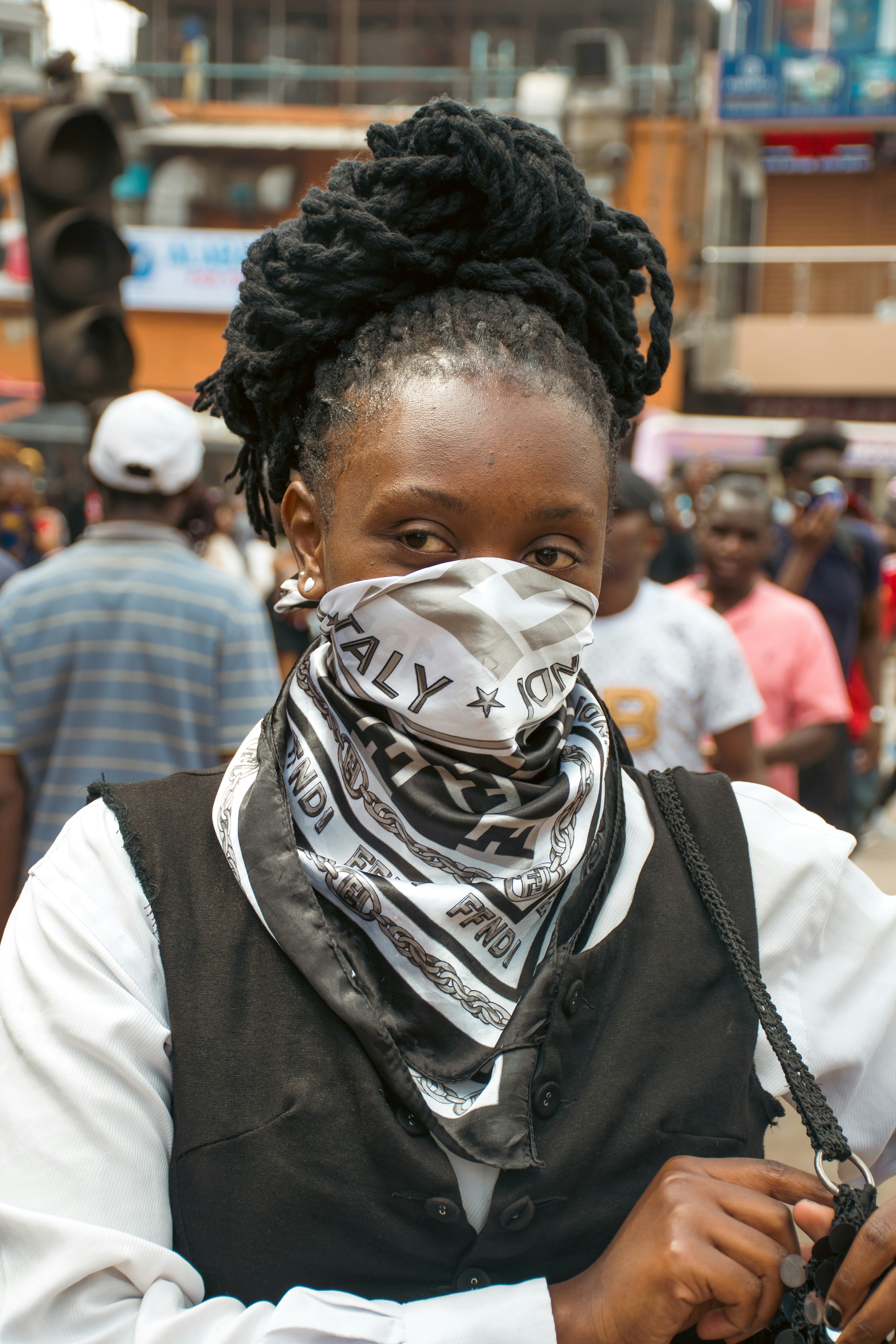 A woman with a bandana covering her face photo – Free Current events ...