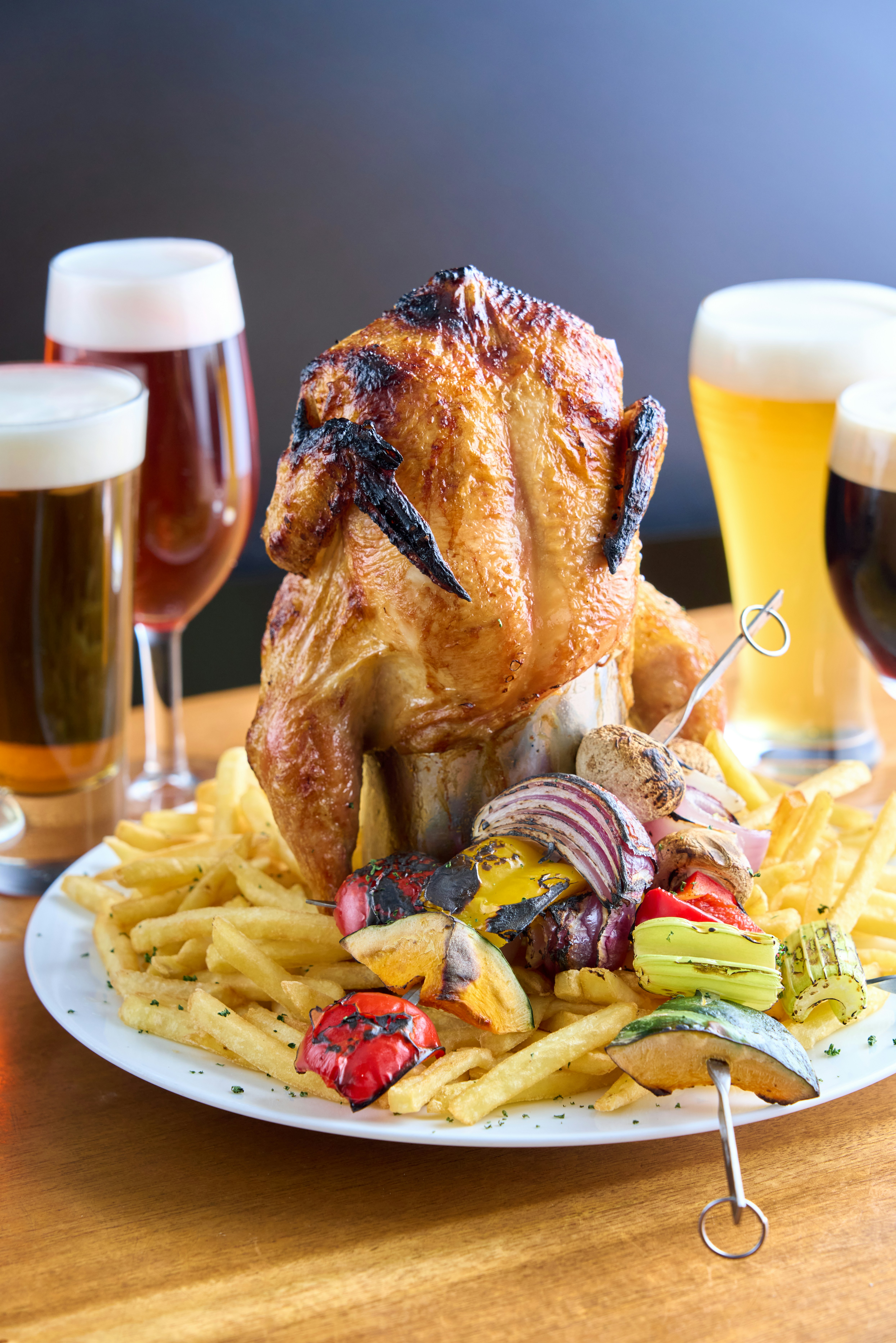 Beer Pairing Platter: A Roast Chicken Tower Surrounded by Golden Fries