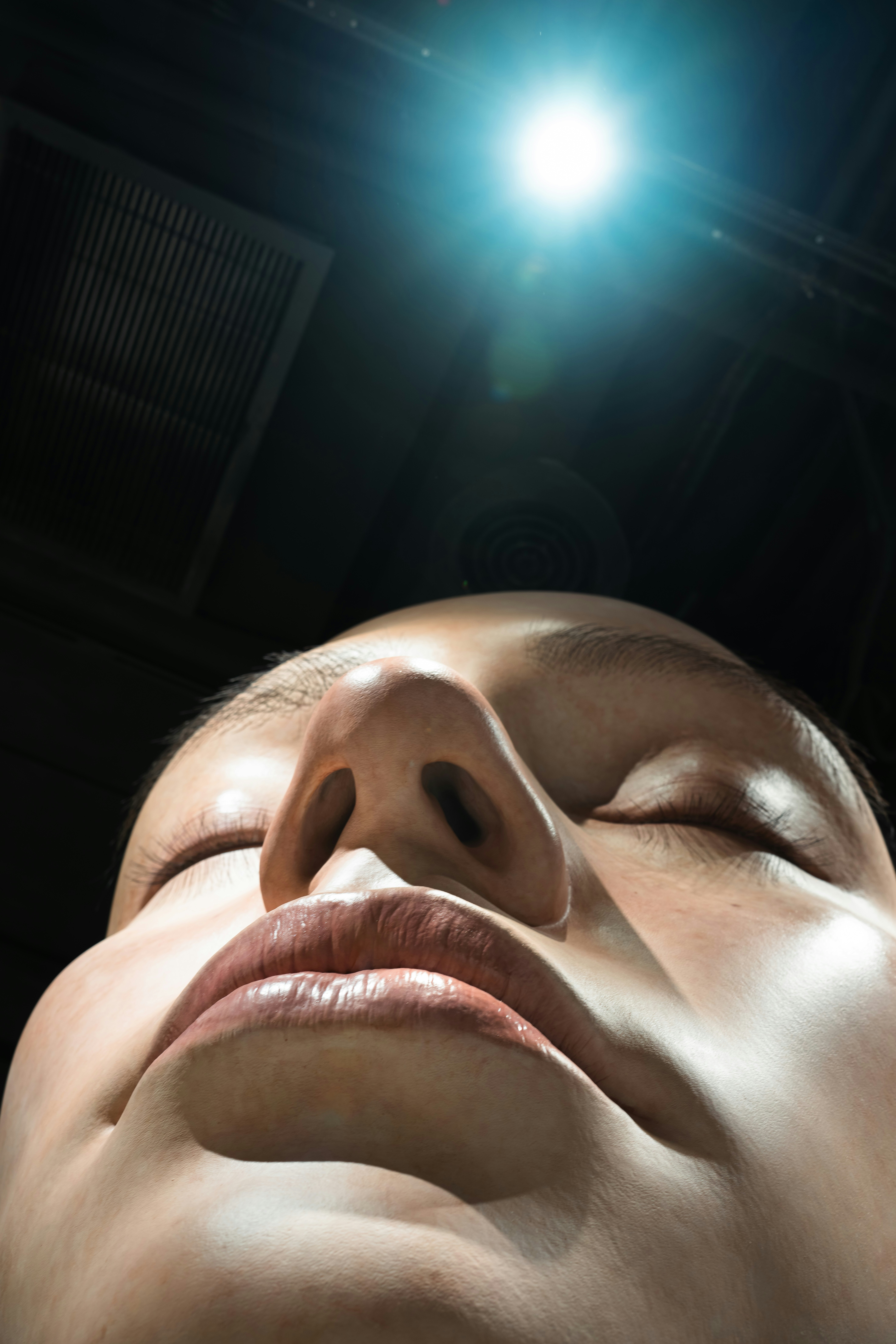 Under the Ceiling's Eye: A Low-Angle Close-Up Portrait