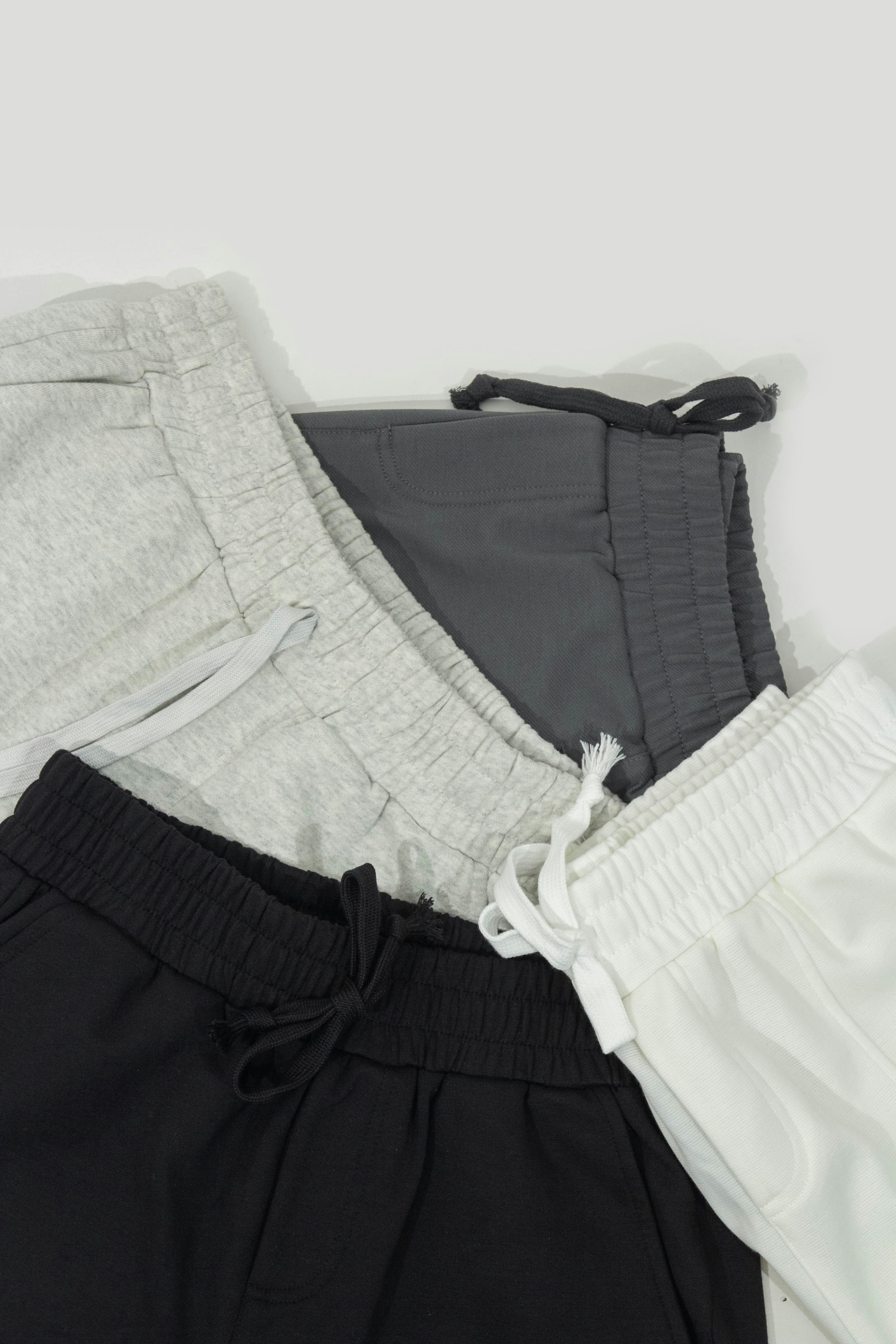 A group of three shorts sitting next to each other photo – Free Grey ...