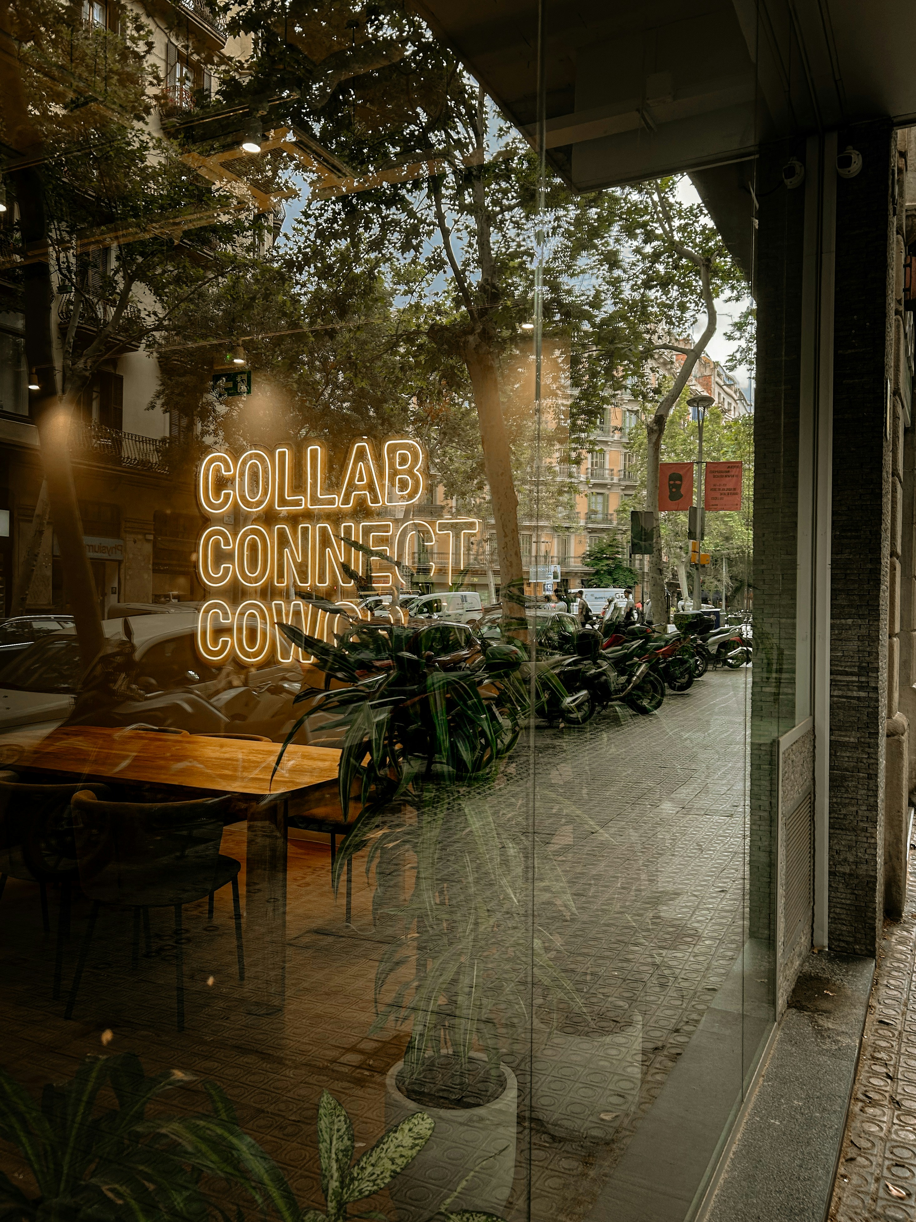 A window with a sign that reads collab connection co photo – Free Car ...