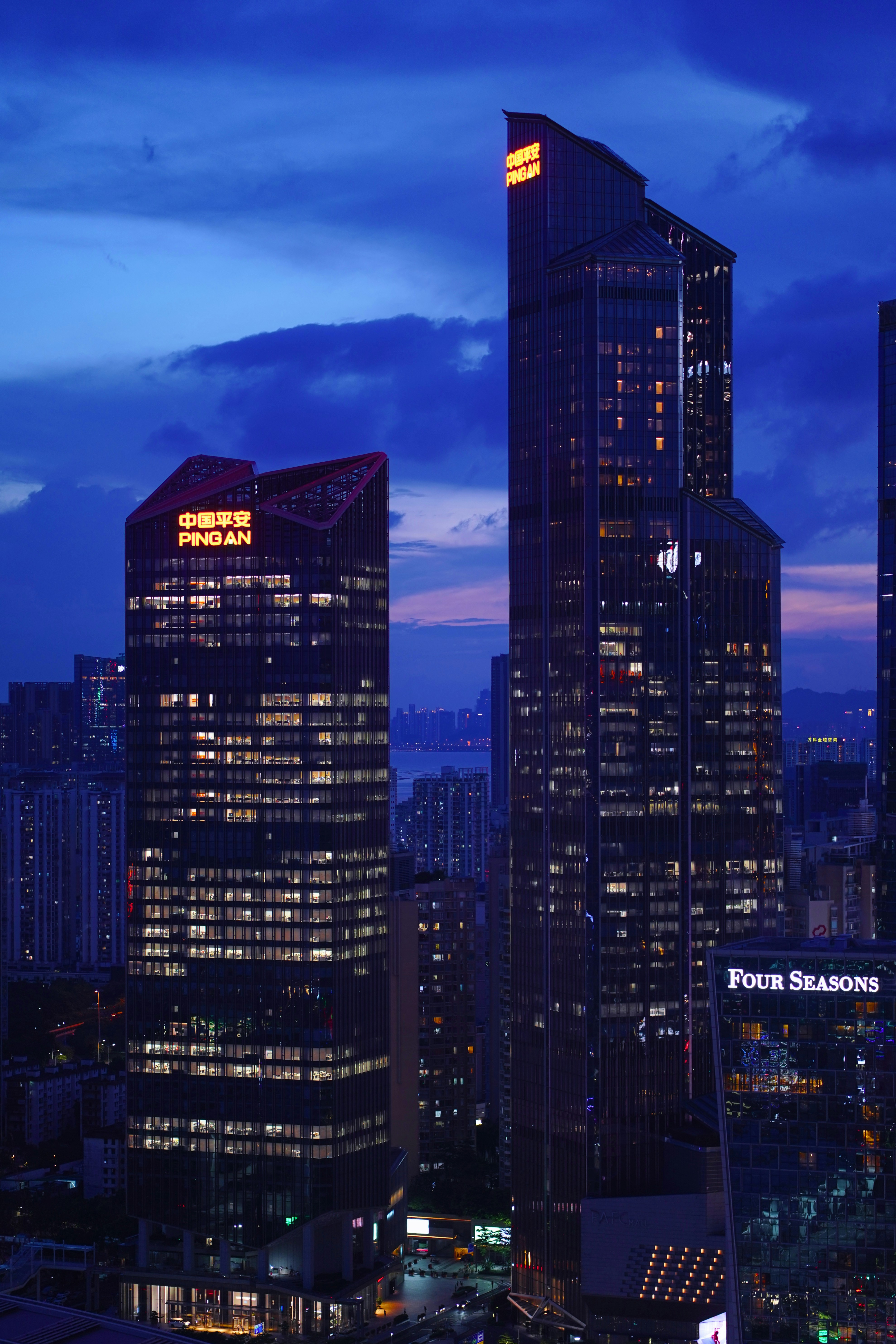 A view of a city at night from the top of a building photo – Free ...