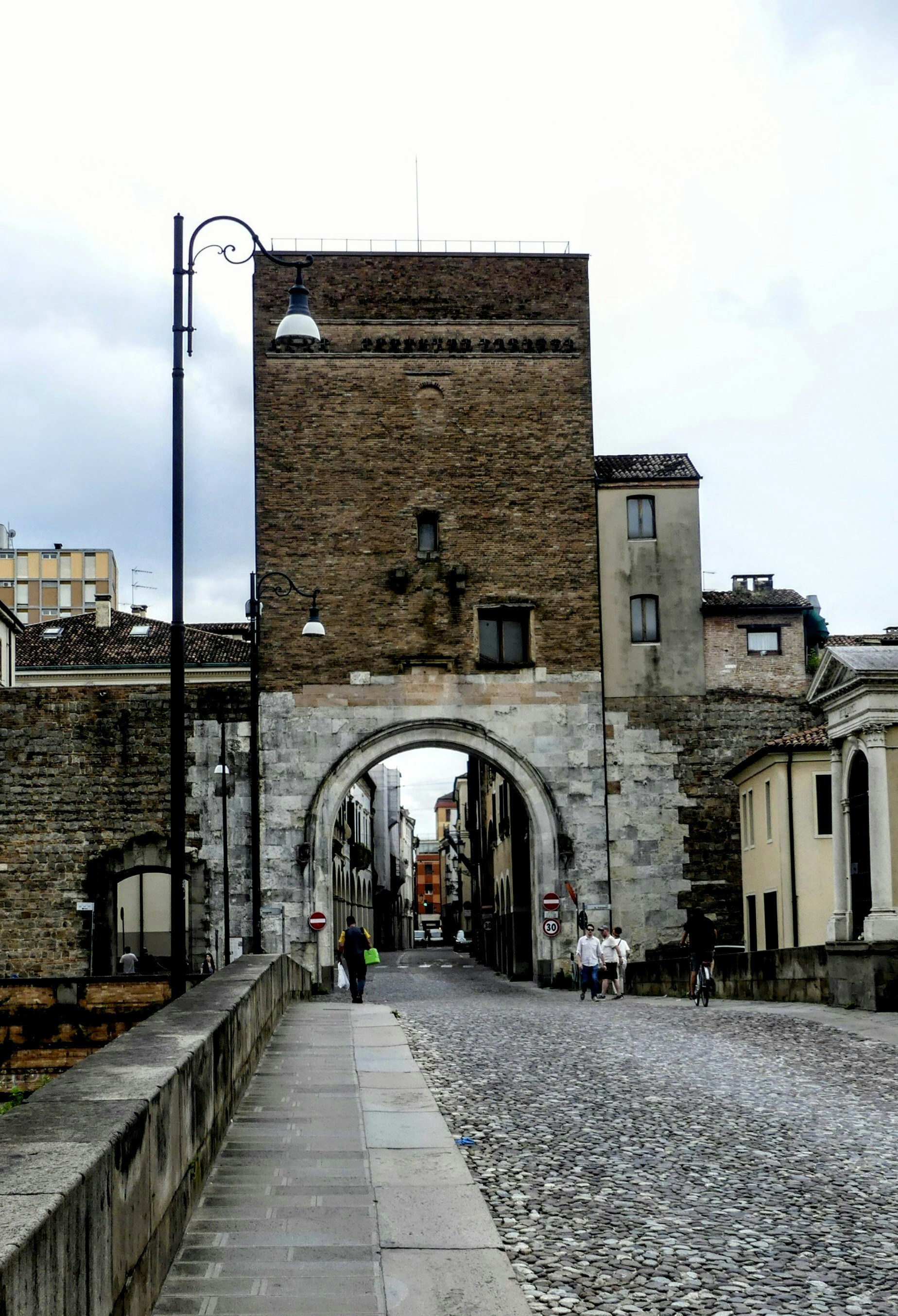 Gateway to the Old Town: Archway through the Cobblestone Street