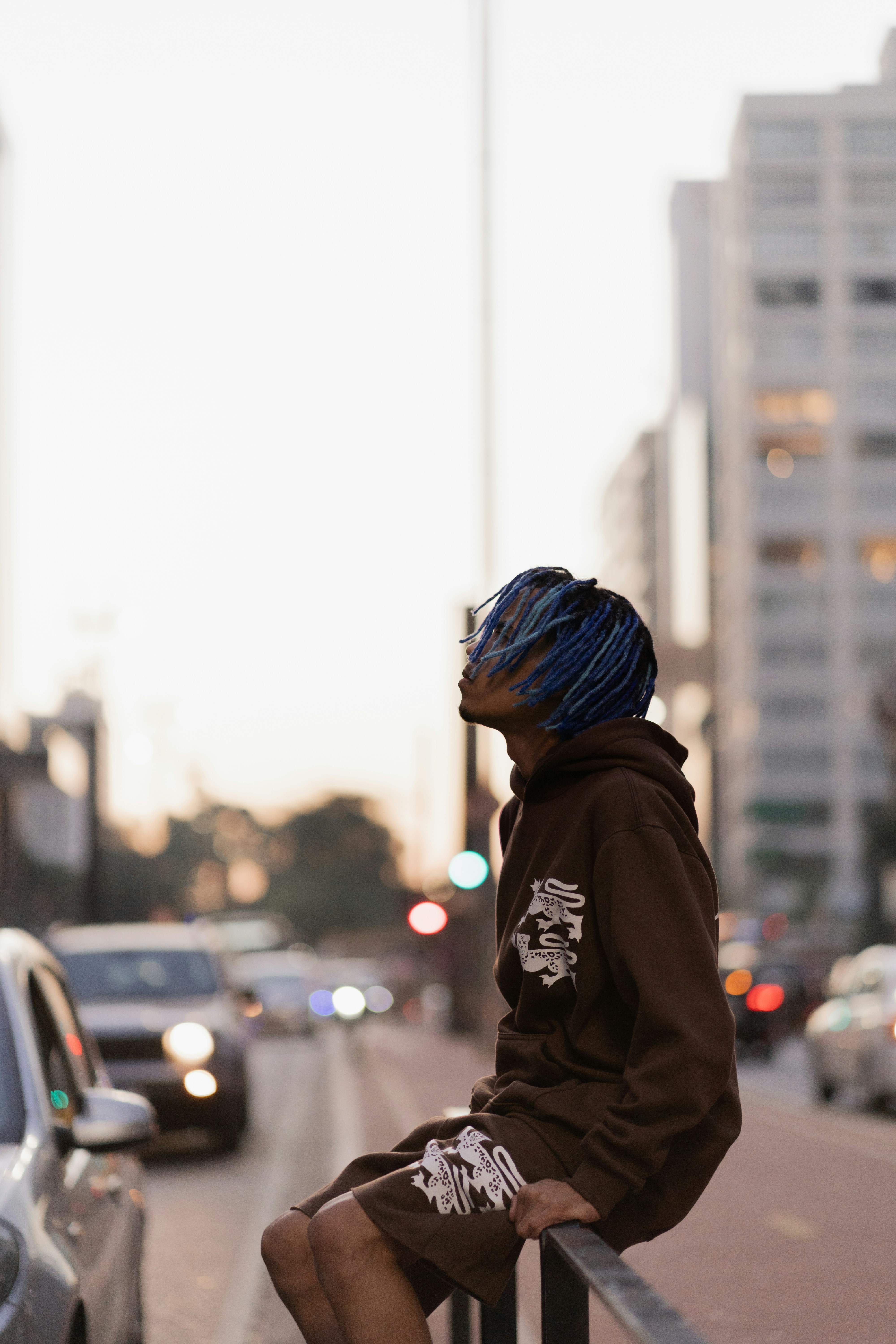 Blue Hair, City Glo: A Quiet Moment on the Rails