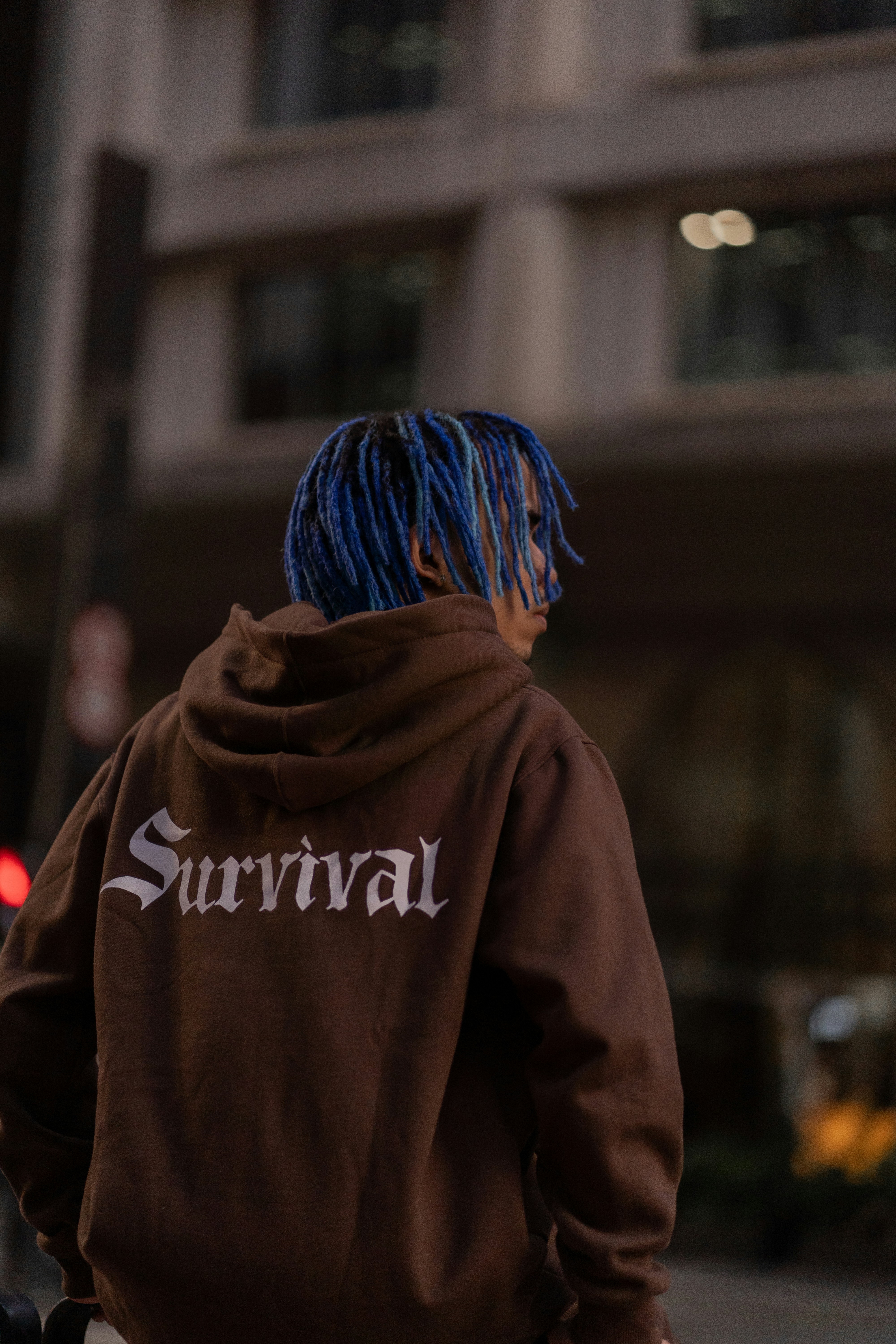 Survival on the Street: Back-Turned Portrait of Blue Braids